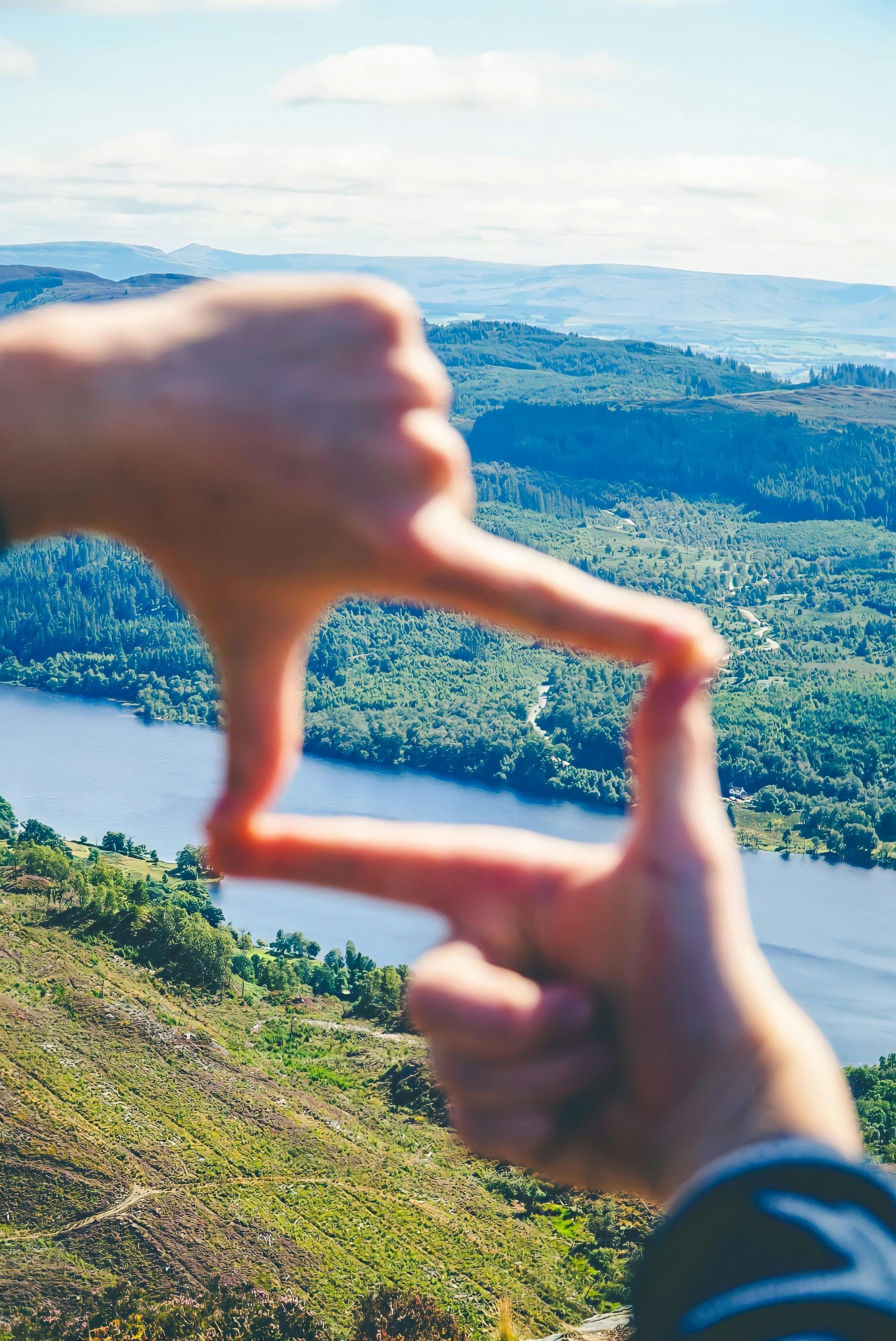 a Person Hand Forming the Take a Picture Sign · Free Stock Photo