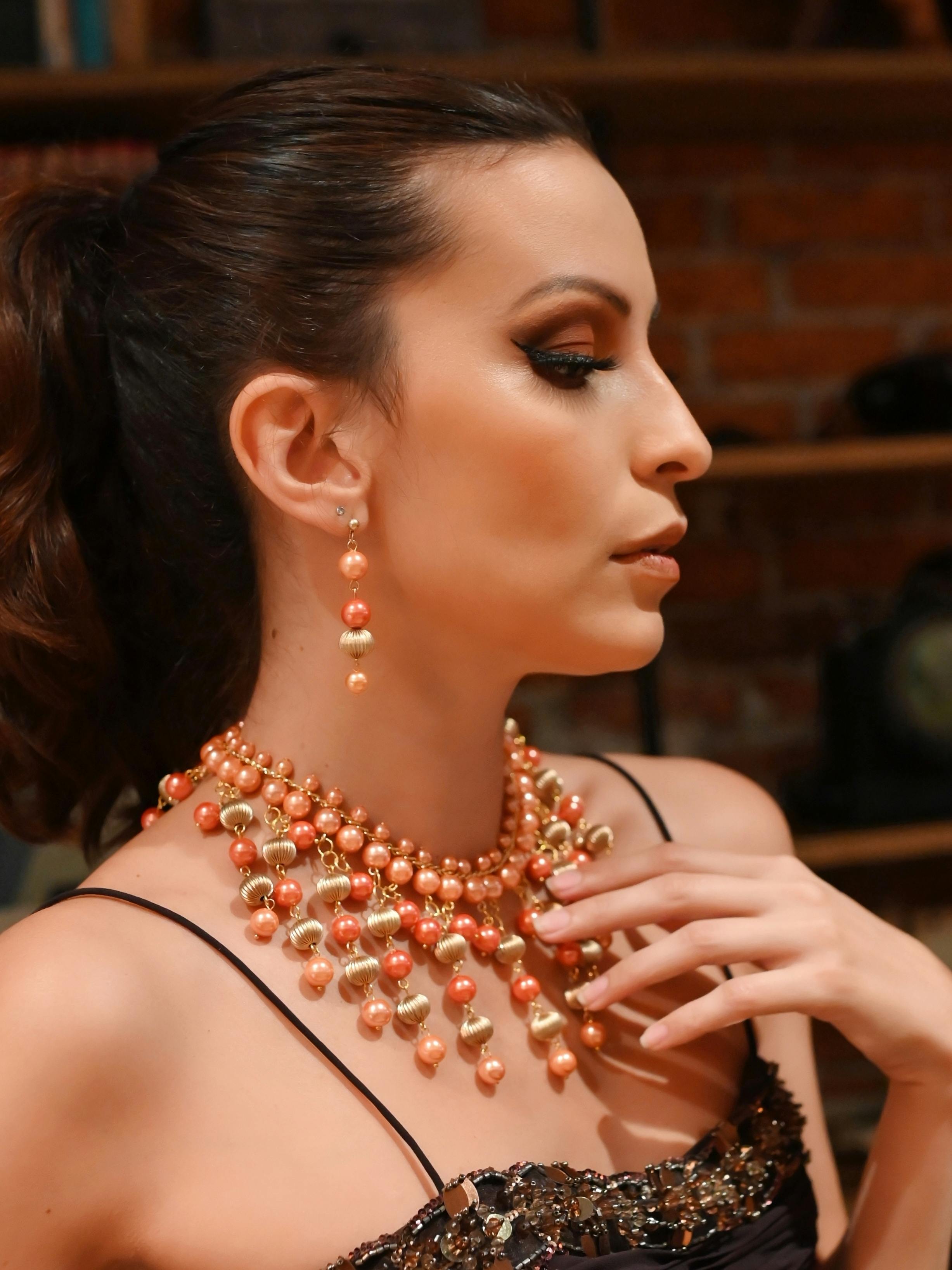 Woman Wearing Makeup and Dangling Earrings · Free Stock Photo