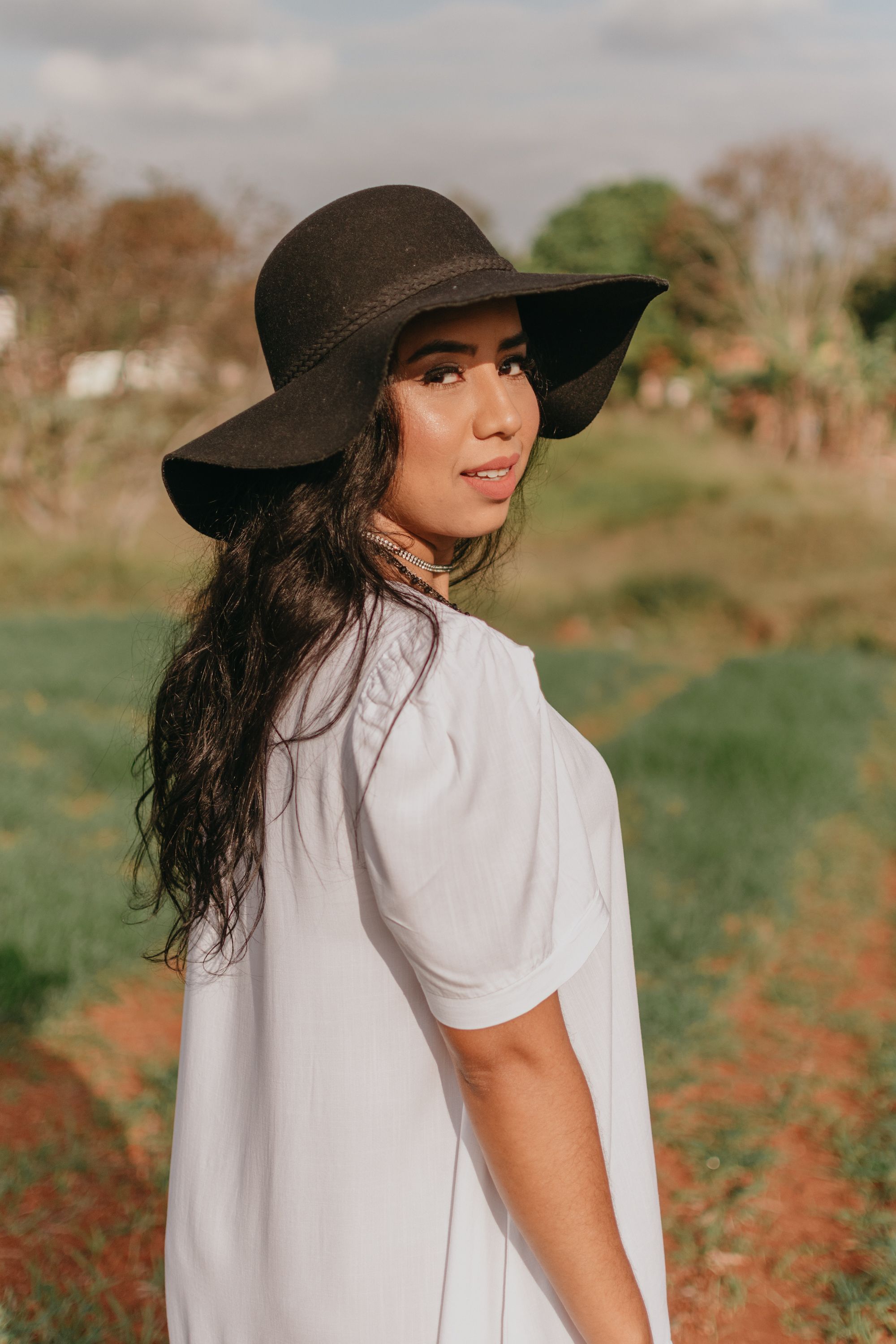 Woman in White Dress Wearing White Hat · Free Stock Photo