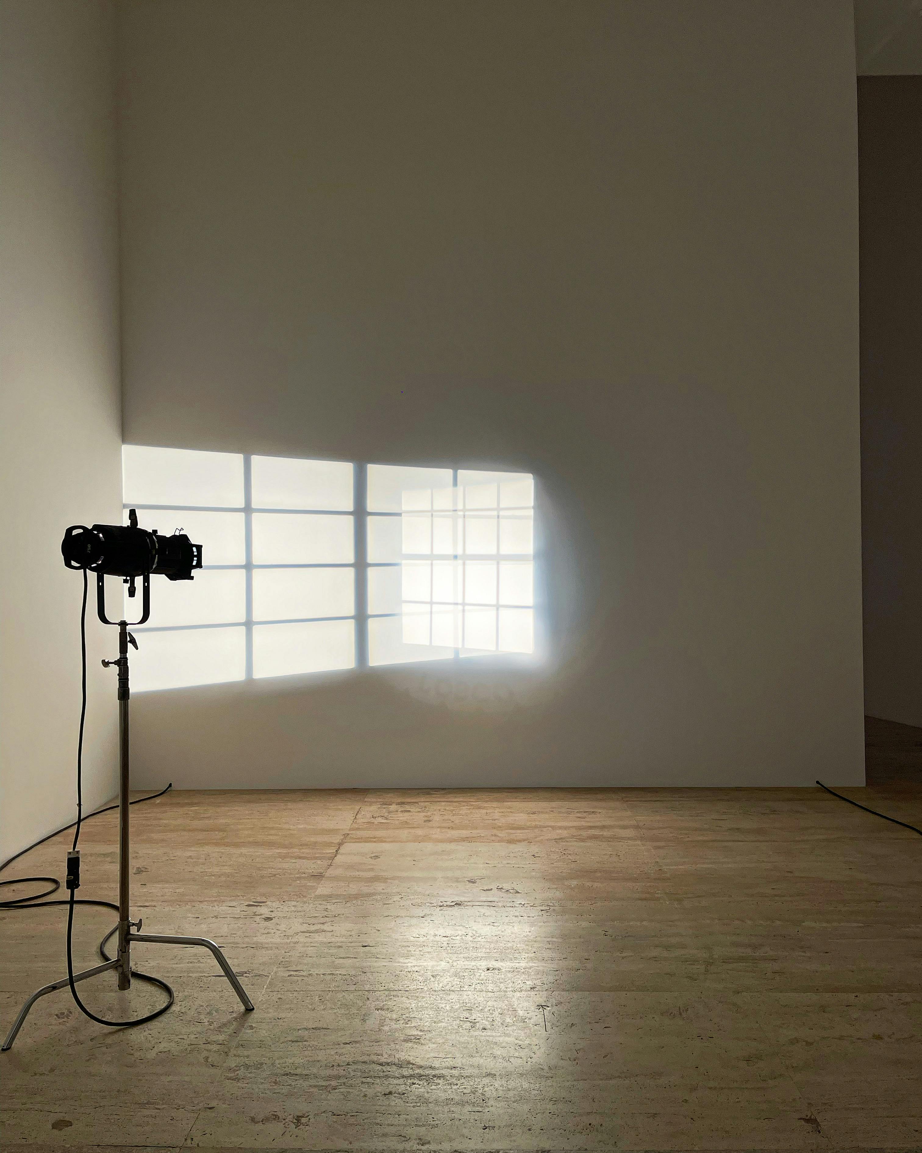 Red Chair on Spotlight Casting Shadow · Free Stock Photo