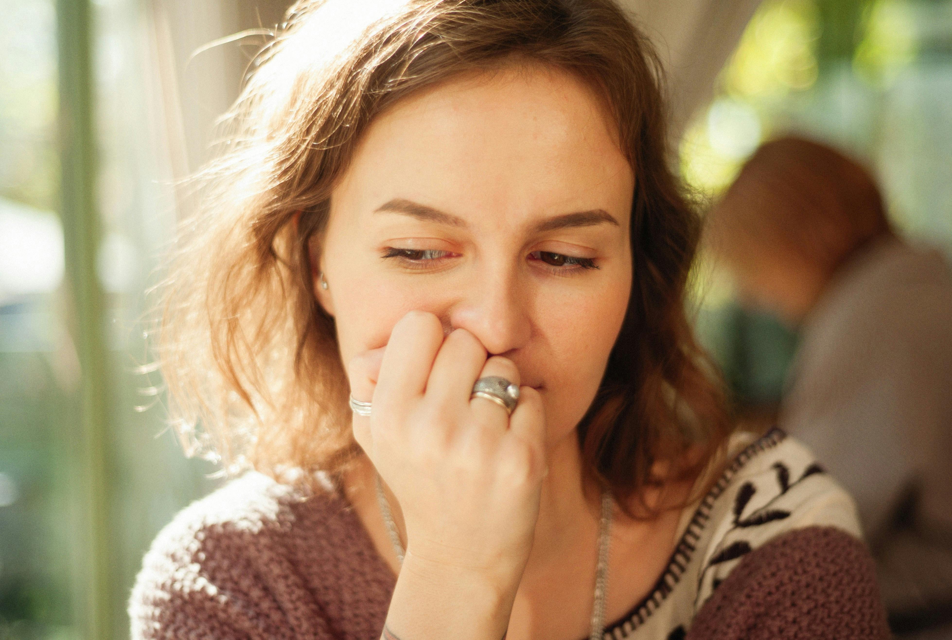 Woman Resting Her Chin on Hand · Free Stock Photo