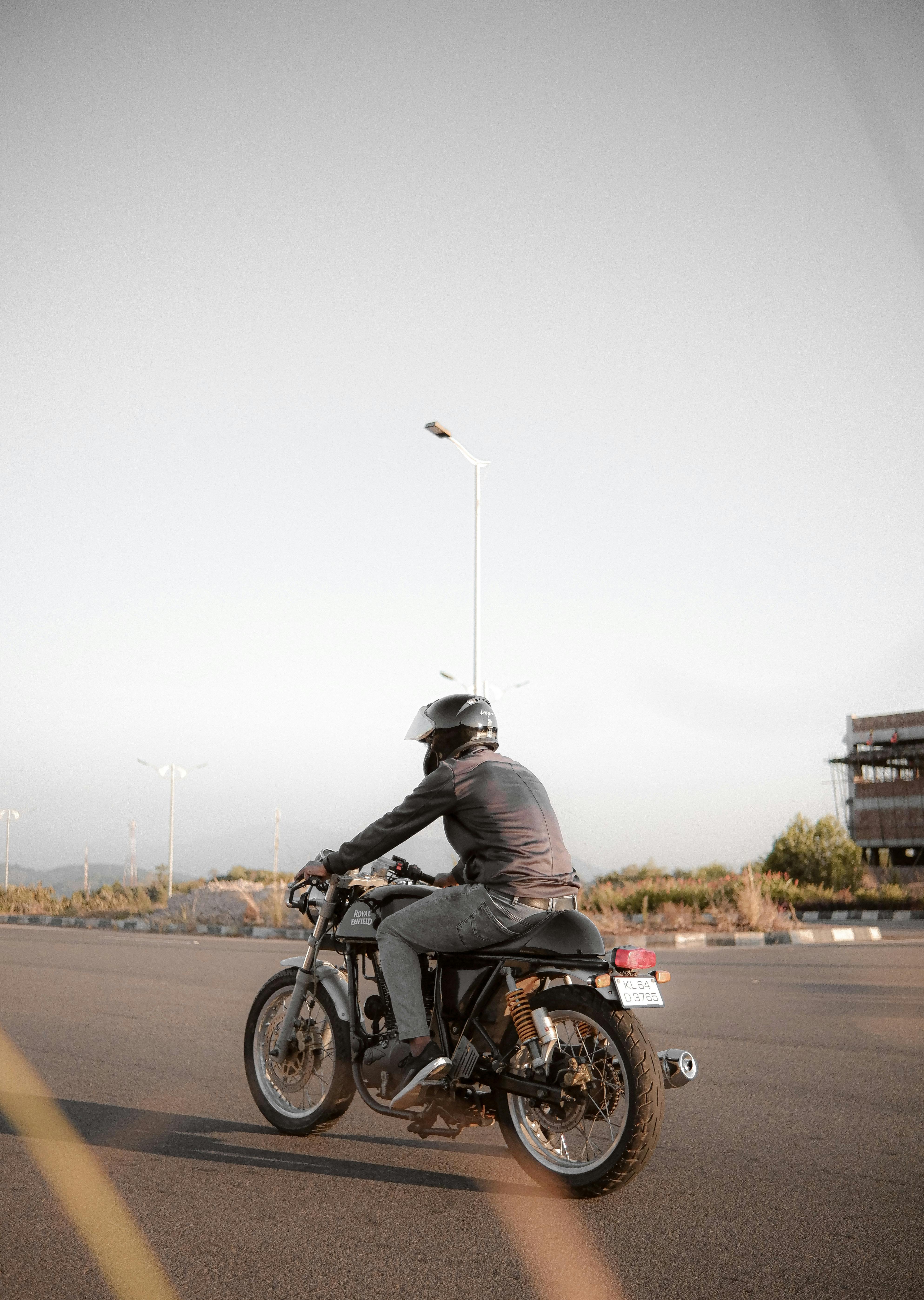 Person Riding Motorcycle during Golden Hour · Free Stock Photo