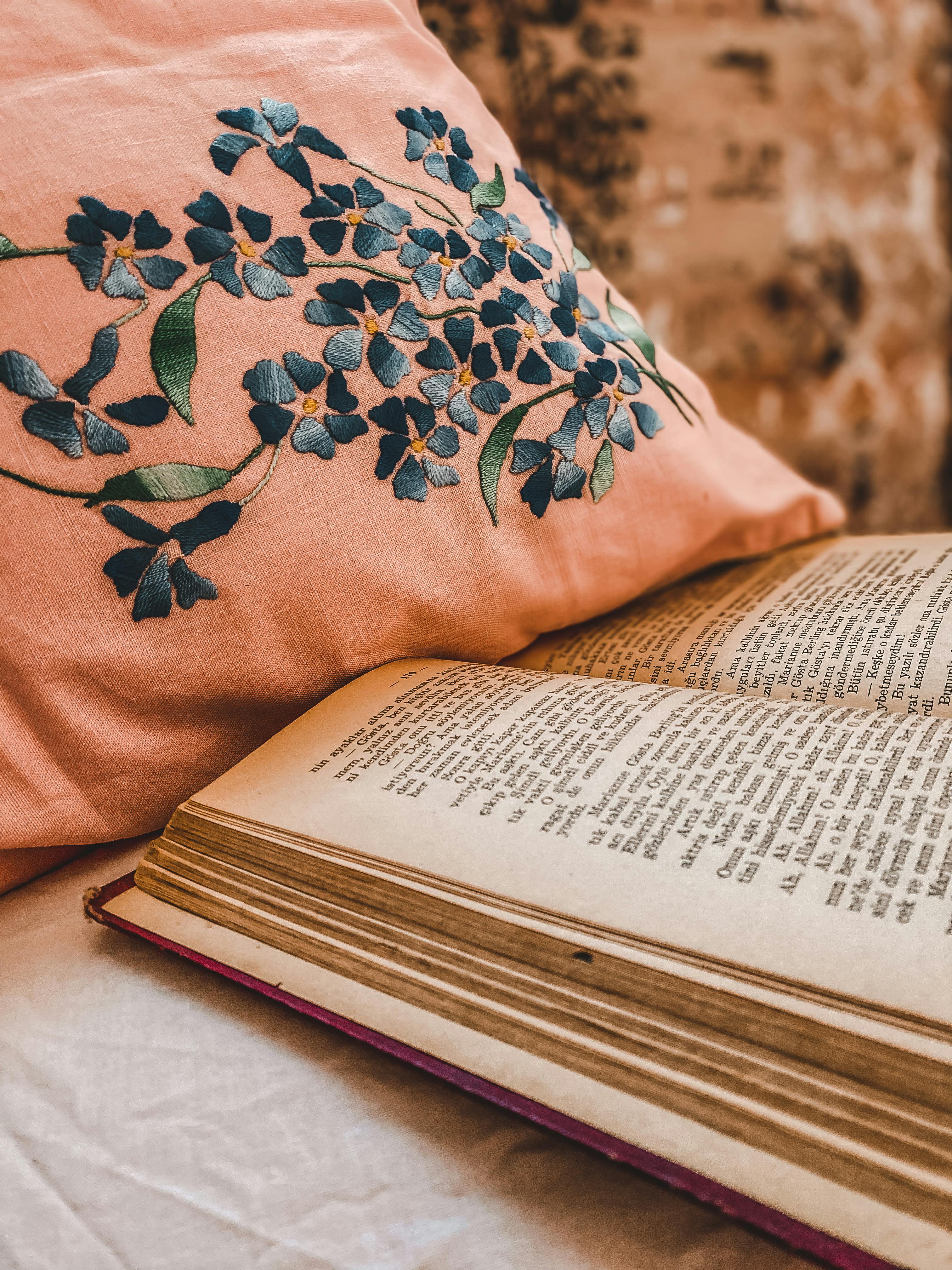Open Book on White Bed Linen · Free Stock Photo