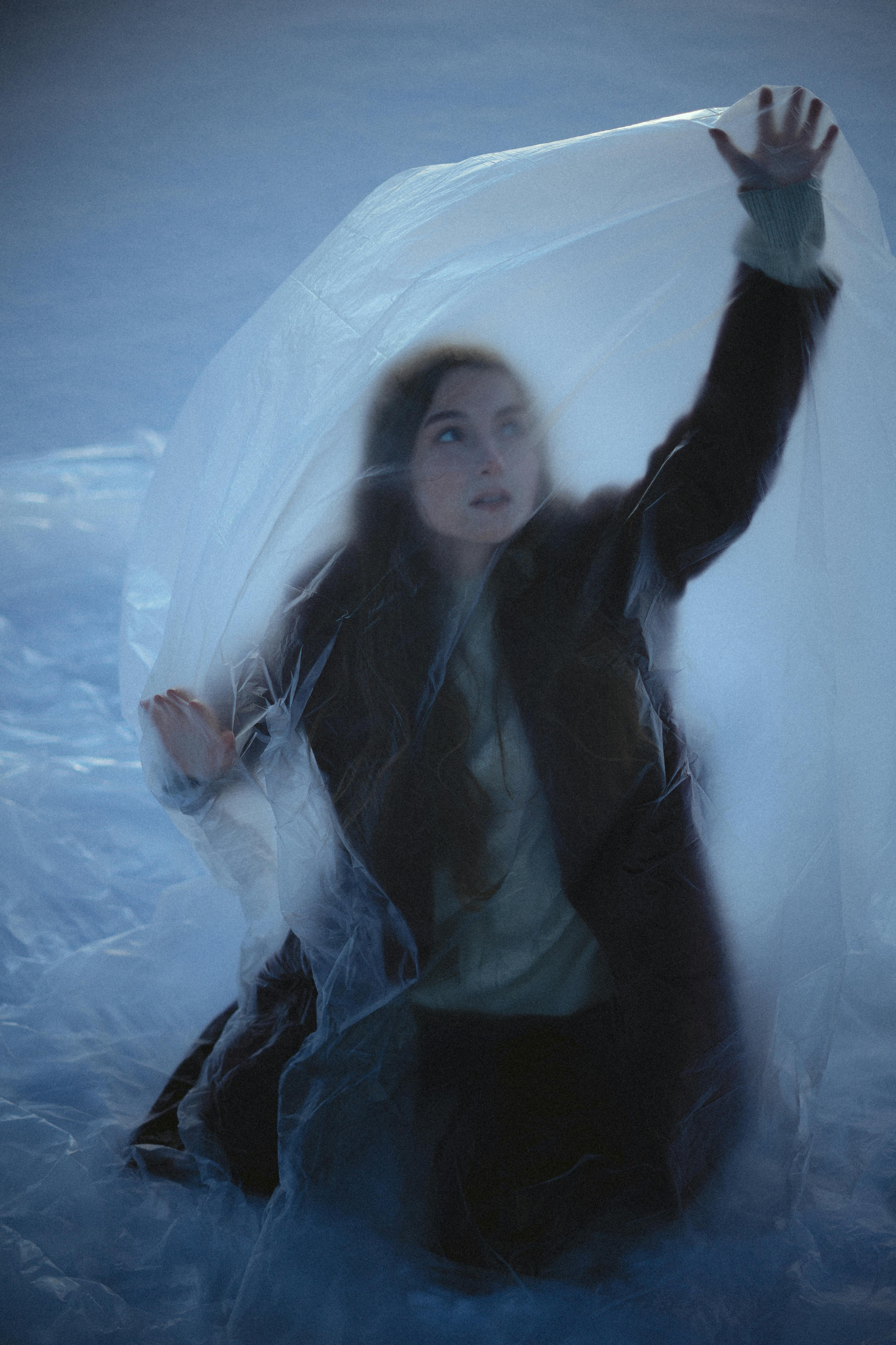 Woman Standing Under Sheer Fabric · Free Stock Photo