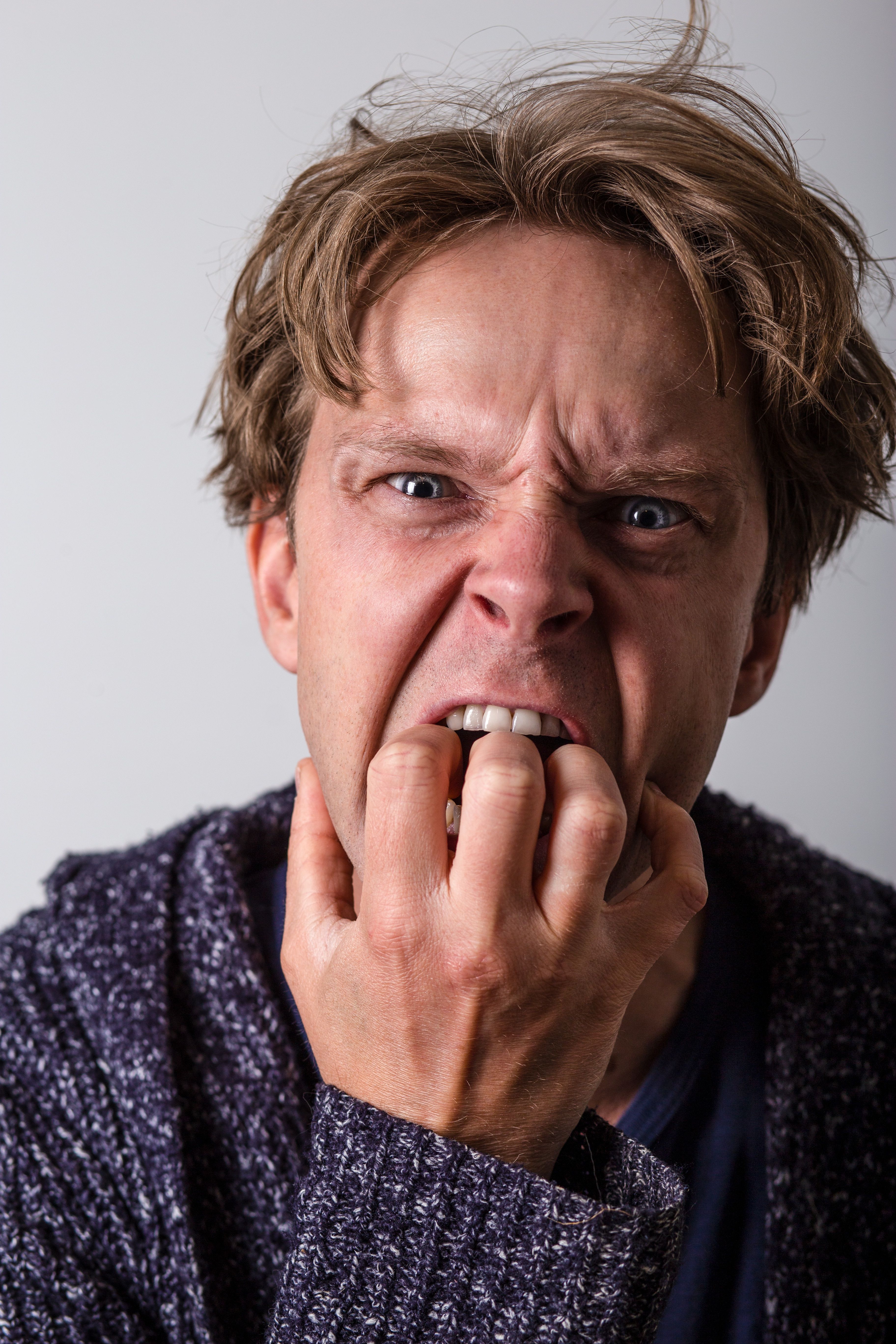 Angry Man Putting his Fingers inside his Mouth · Free Stock Photo