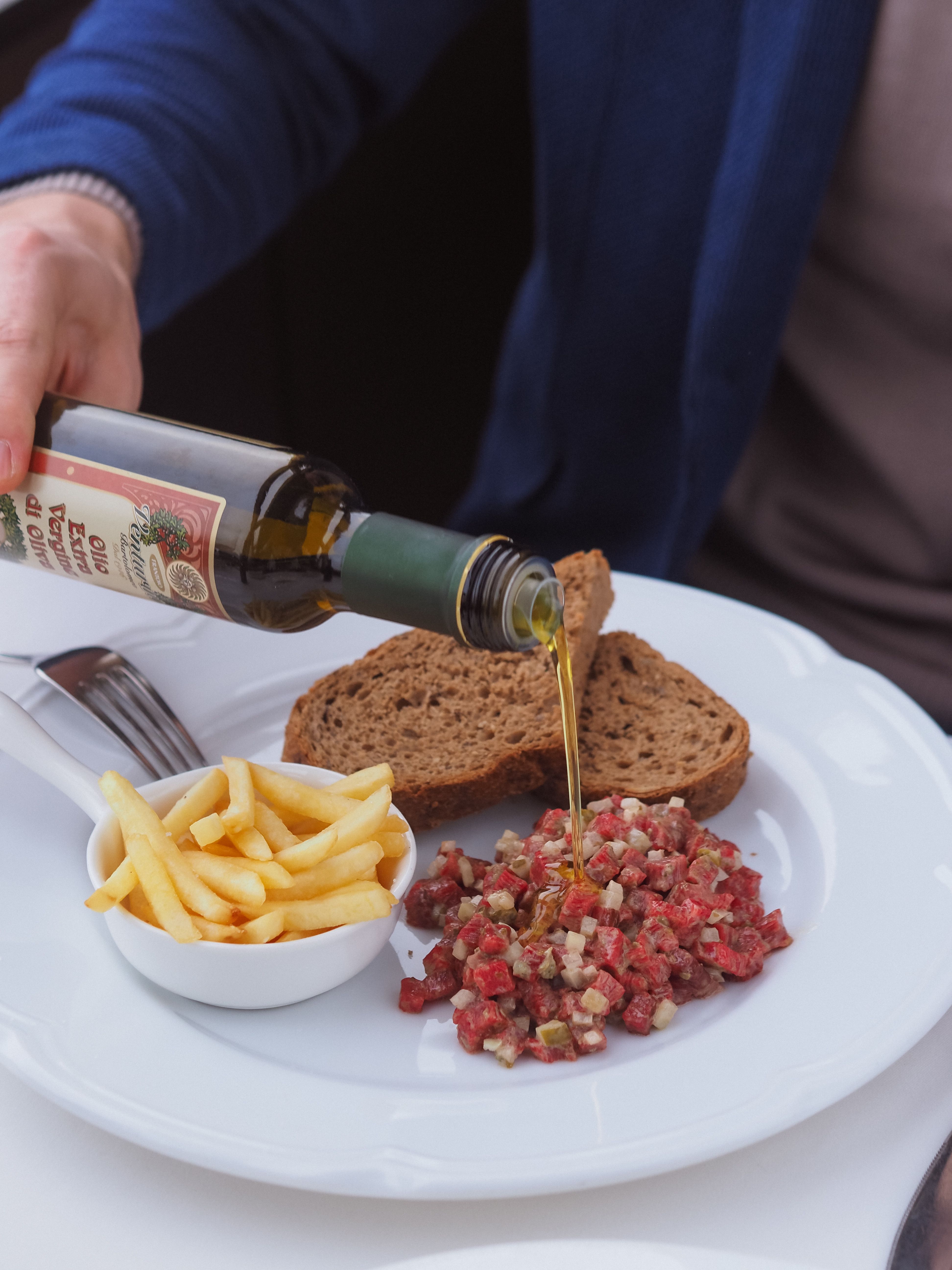 Man Putting Food on His Plate and Smiling · Free Stock Photo