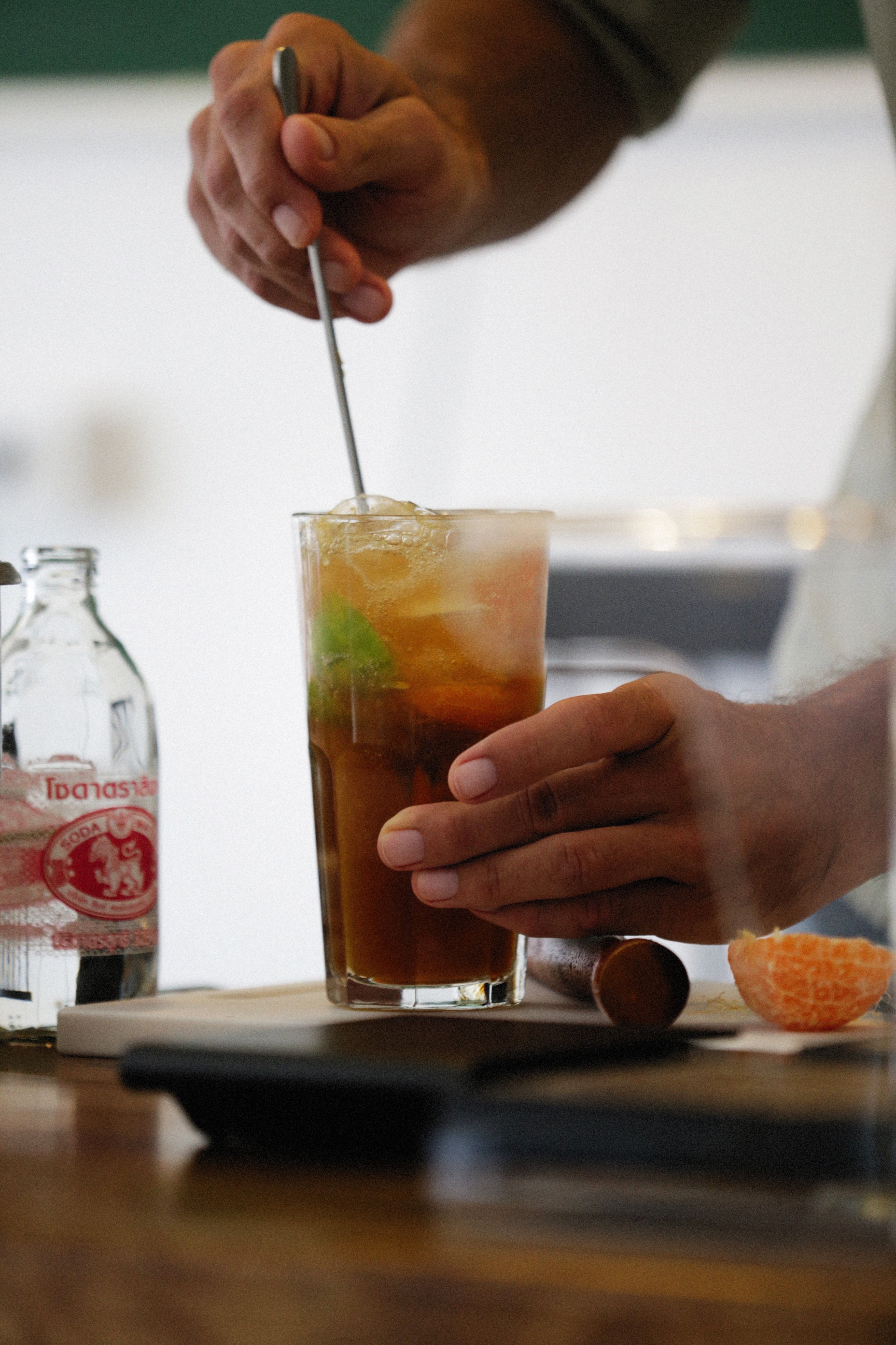 Person Hand with Cocktail at Bar Counter · Free Stock Photo
