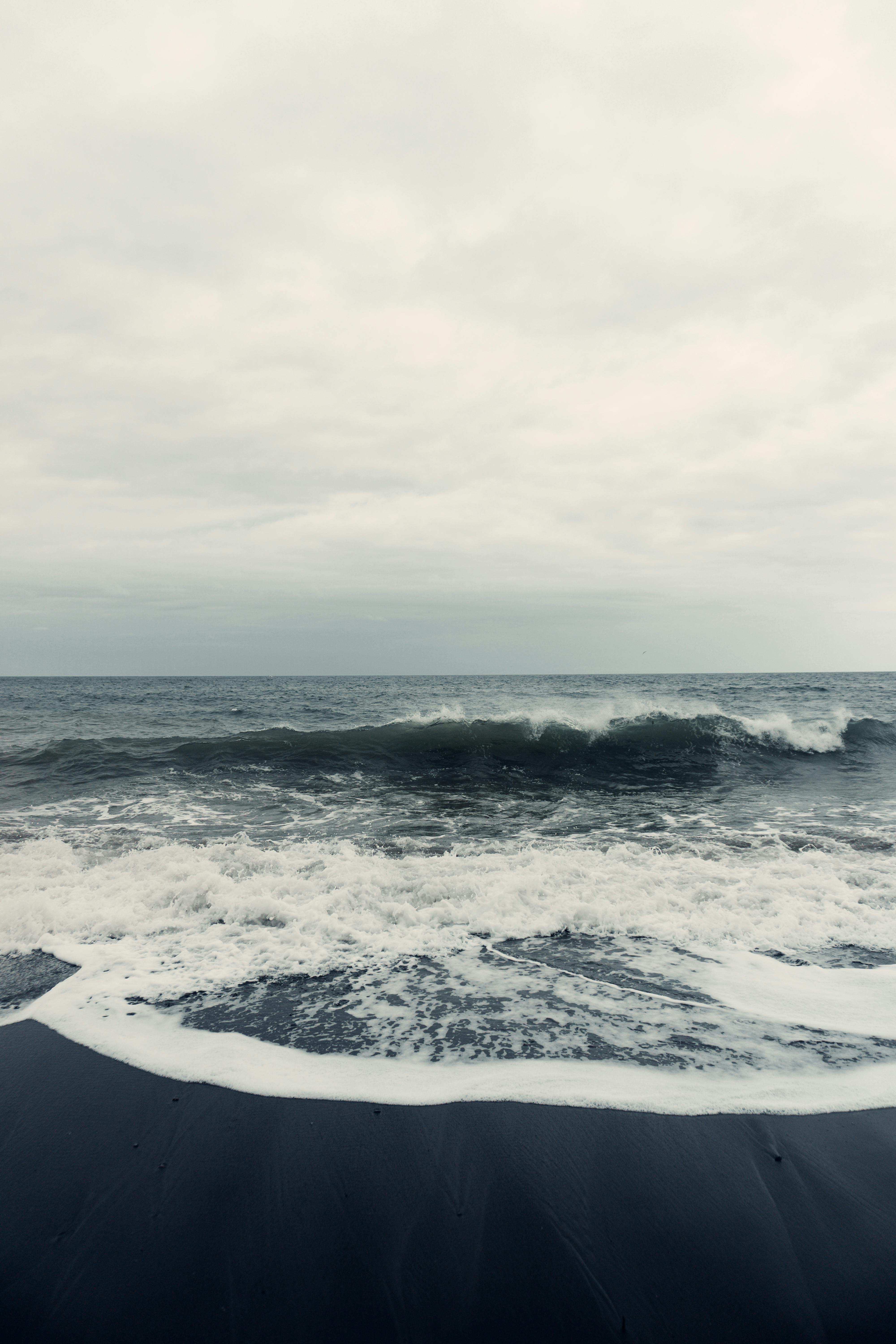 Grayscale Photography of Sea Waves Lapping on Shore · Free Stock Photo