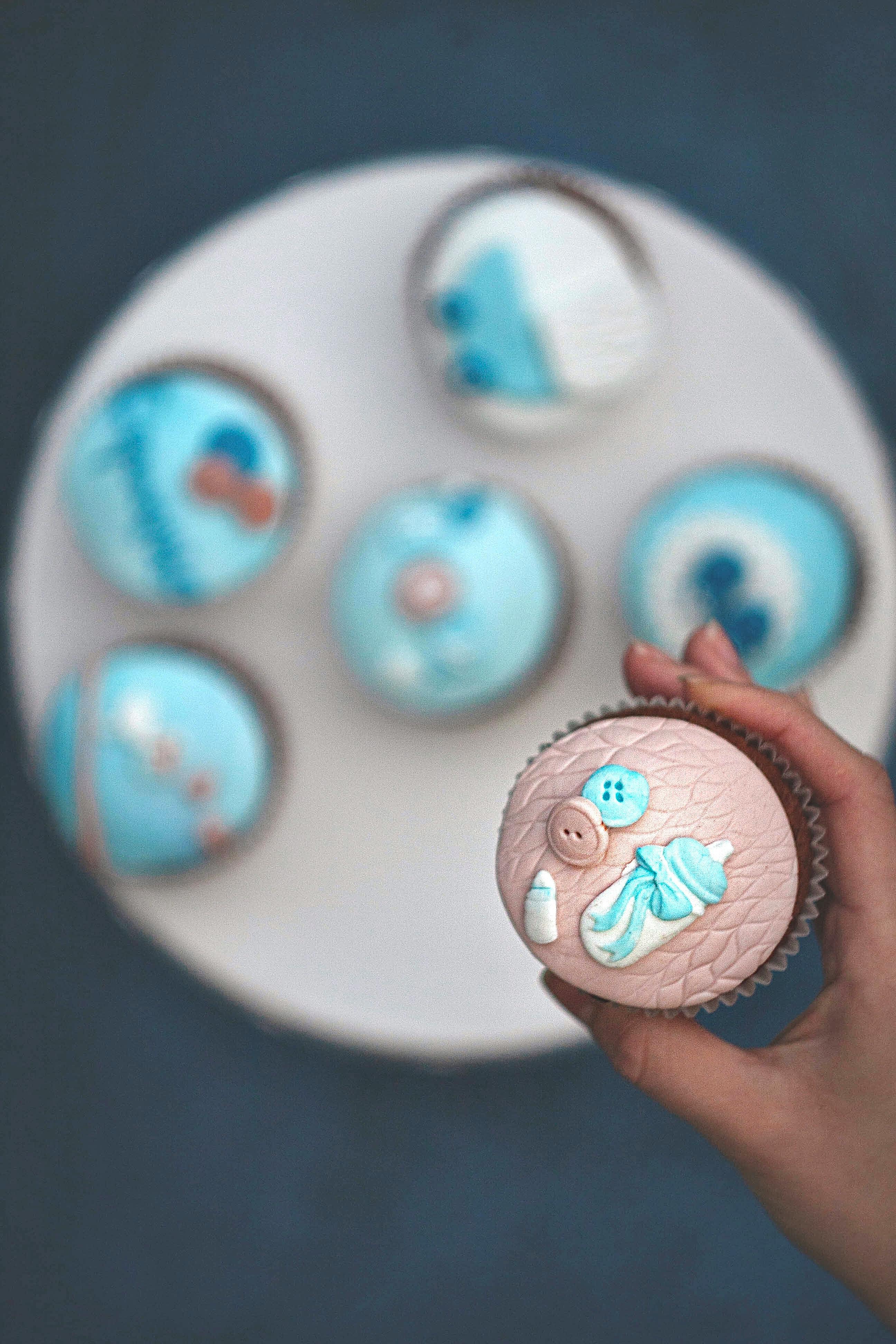 Person Putting Purple Icing Purple on a Cake · Free Stock Photo