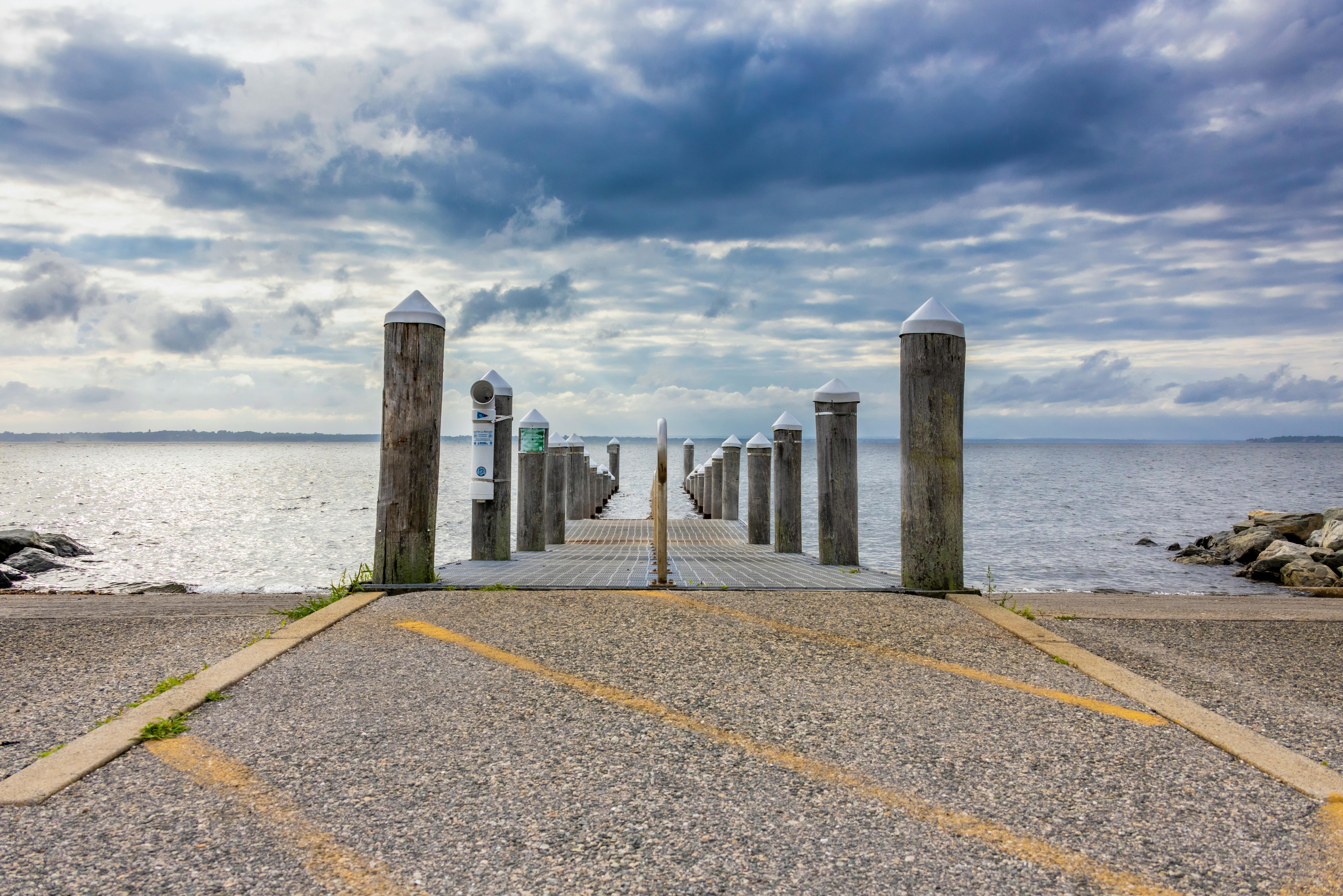 Wooden Dock on a Seashore under Cloudy Sky · Free Stock Photo