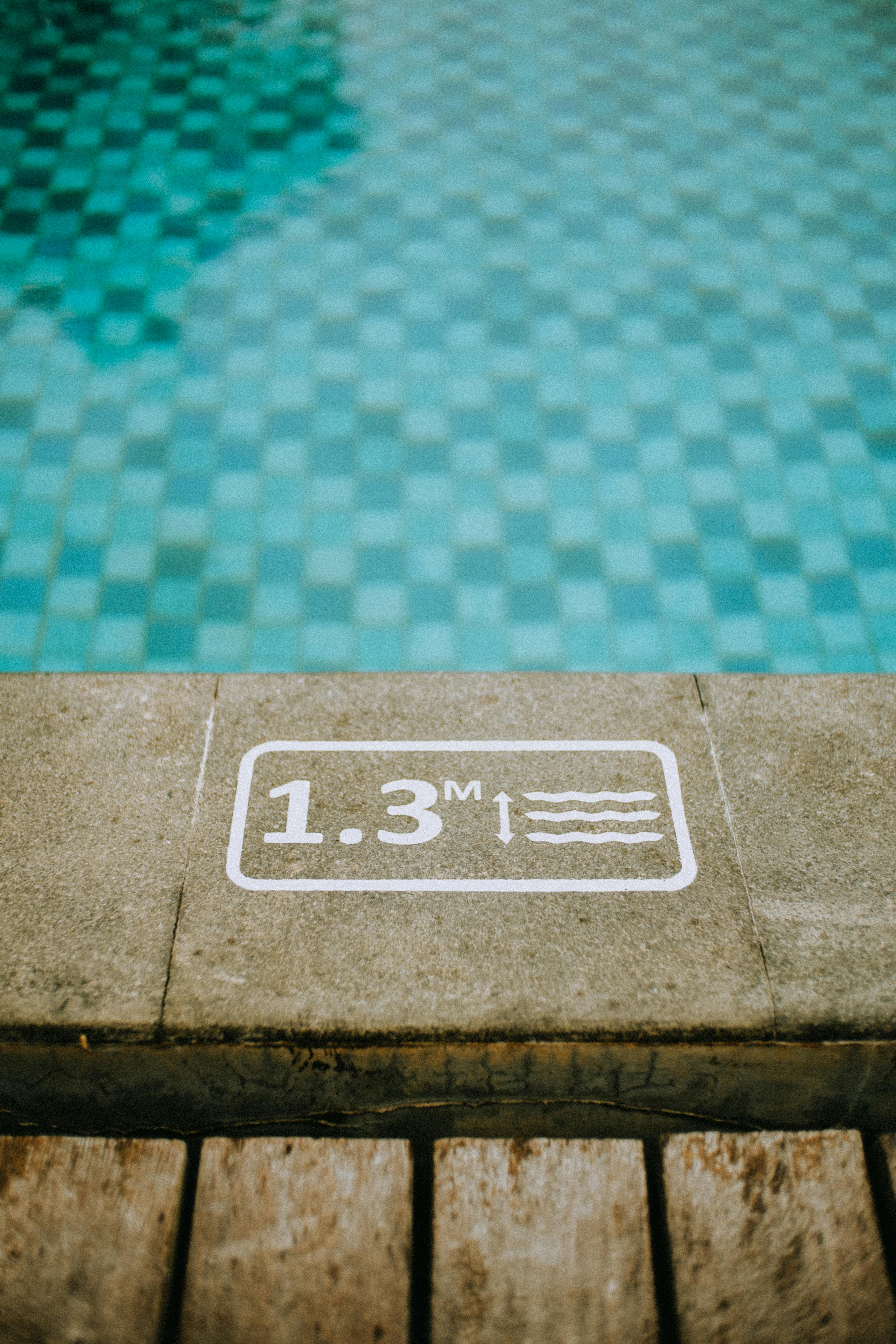 Swimming Pool Depth Marker on the Concrete · Free Stock Photo