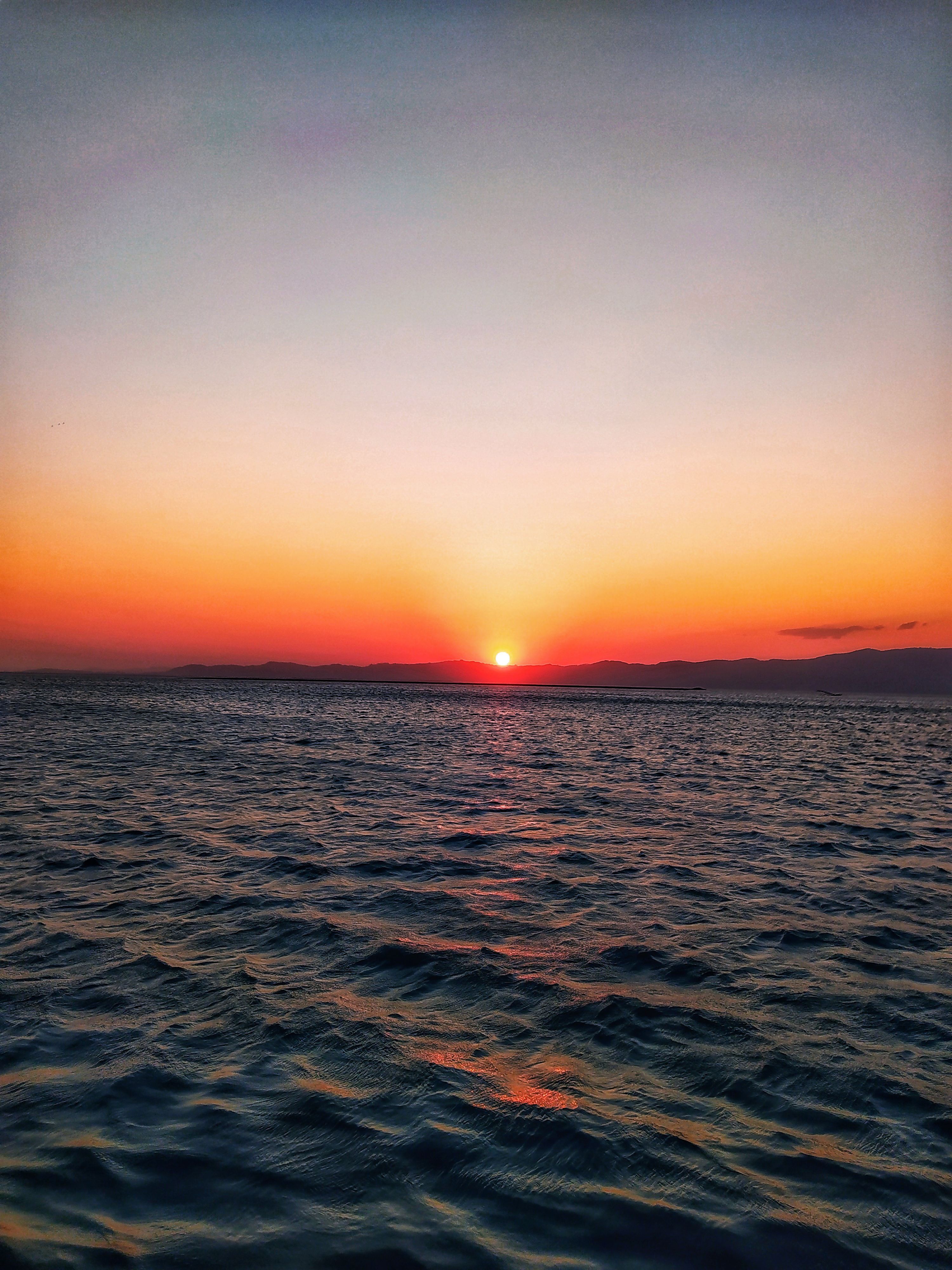 Calm Water in the Sea during Sunset · Free Stock Photo