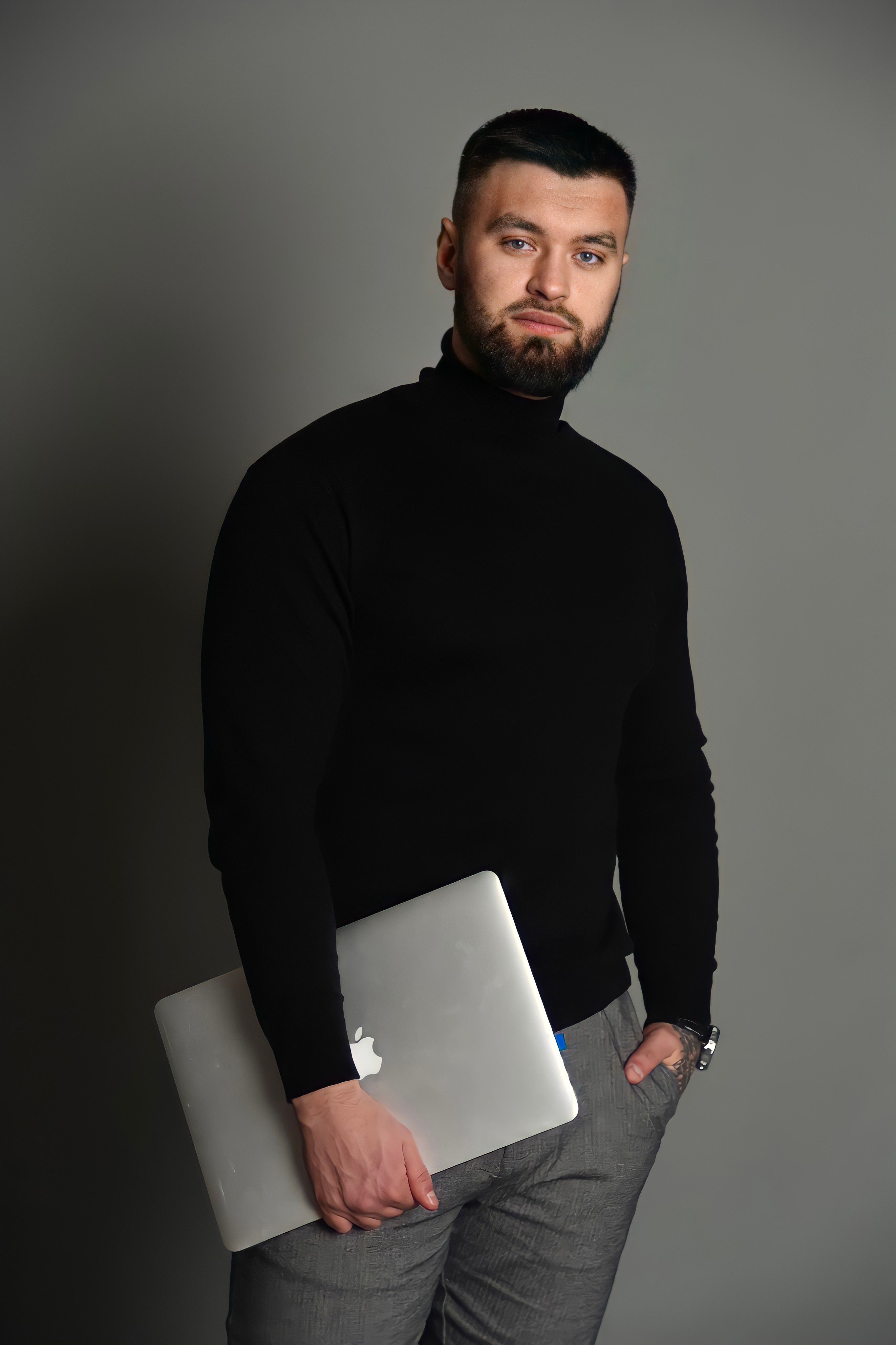 Man in Sweater Holding Laptop · Free Stock Photo