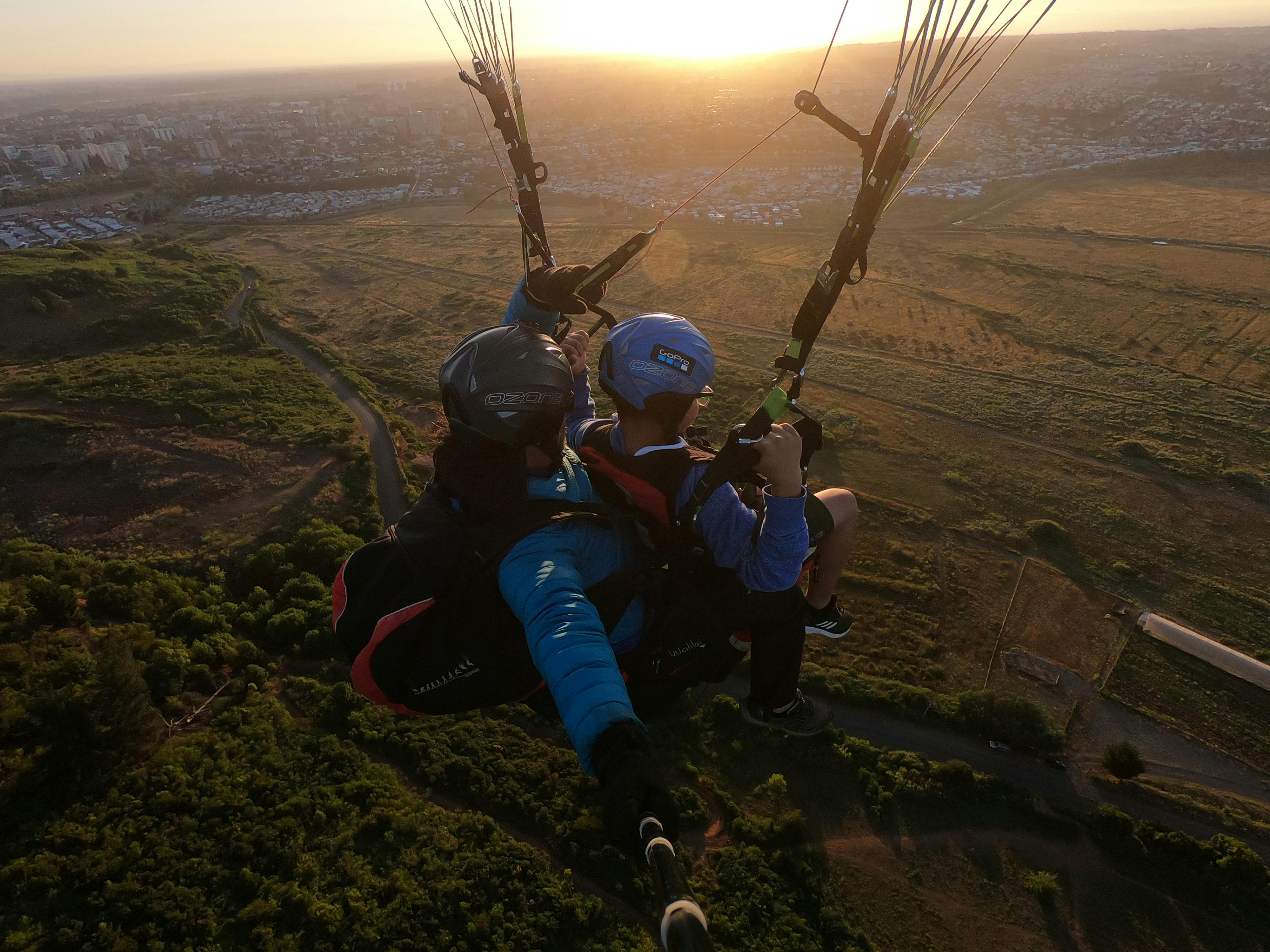 Two People Paragliding at Sunset · Free Stock Photo