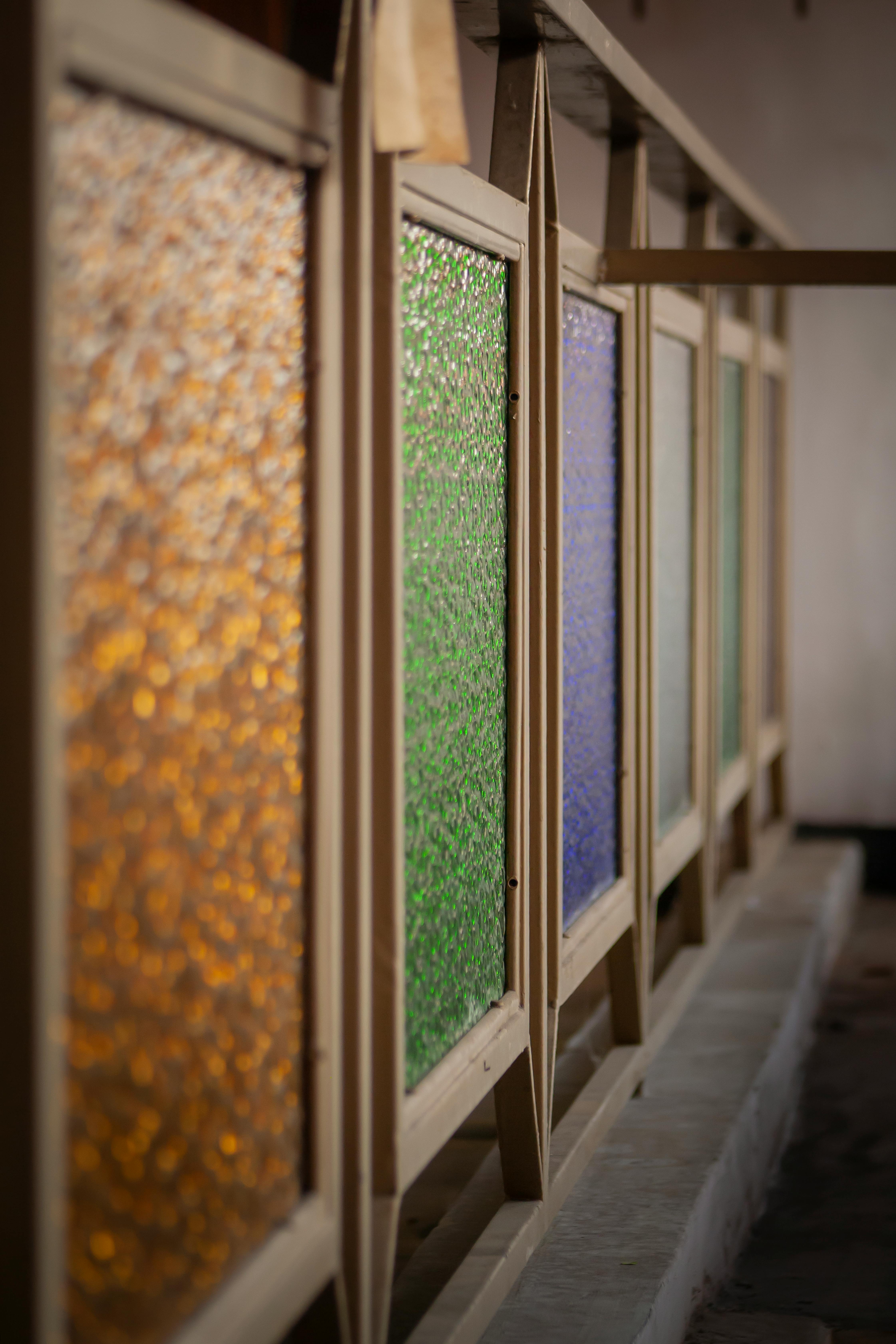 Close-Up Shot of Colorful Glass Windows · Free Stock Photo