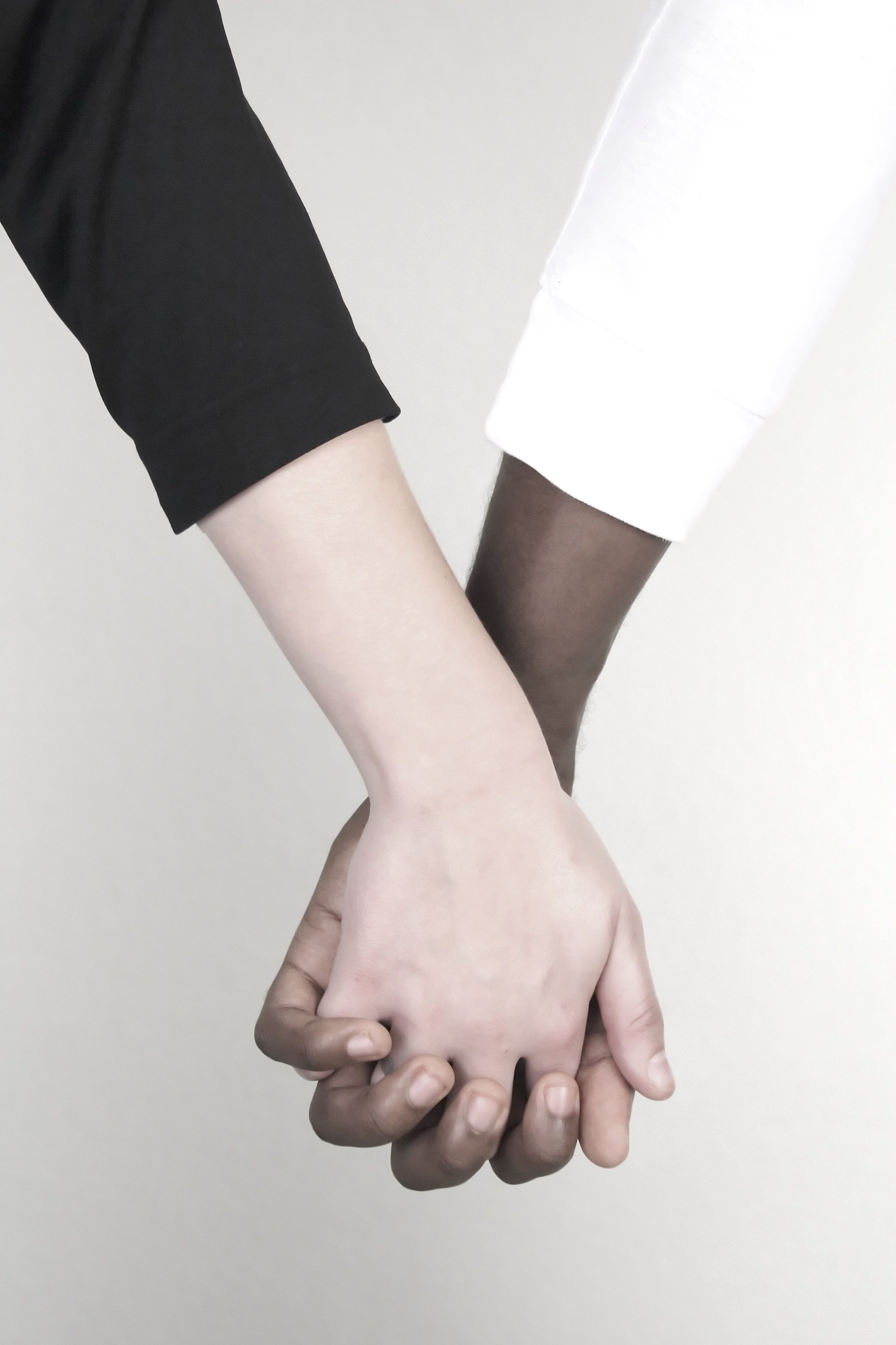 A Close-Up of People Holding Hands · Free Stock Photo