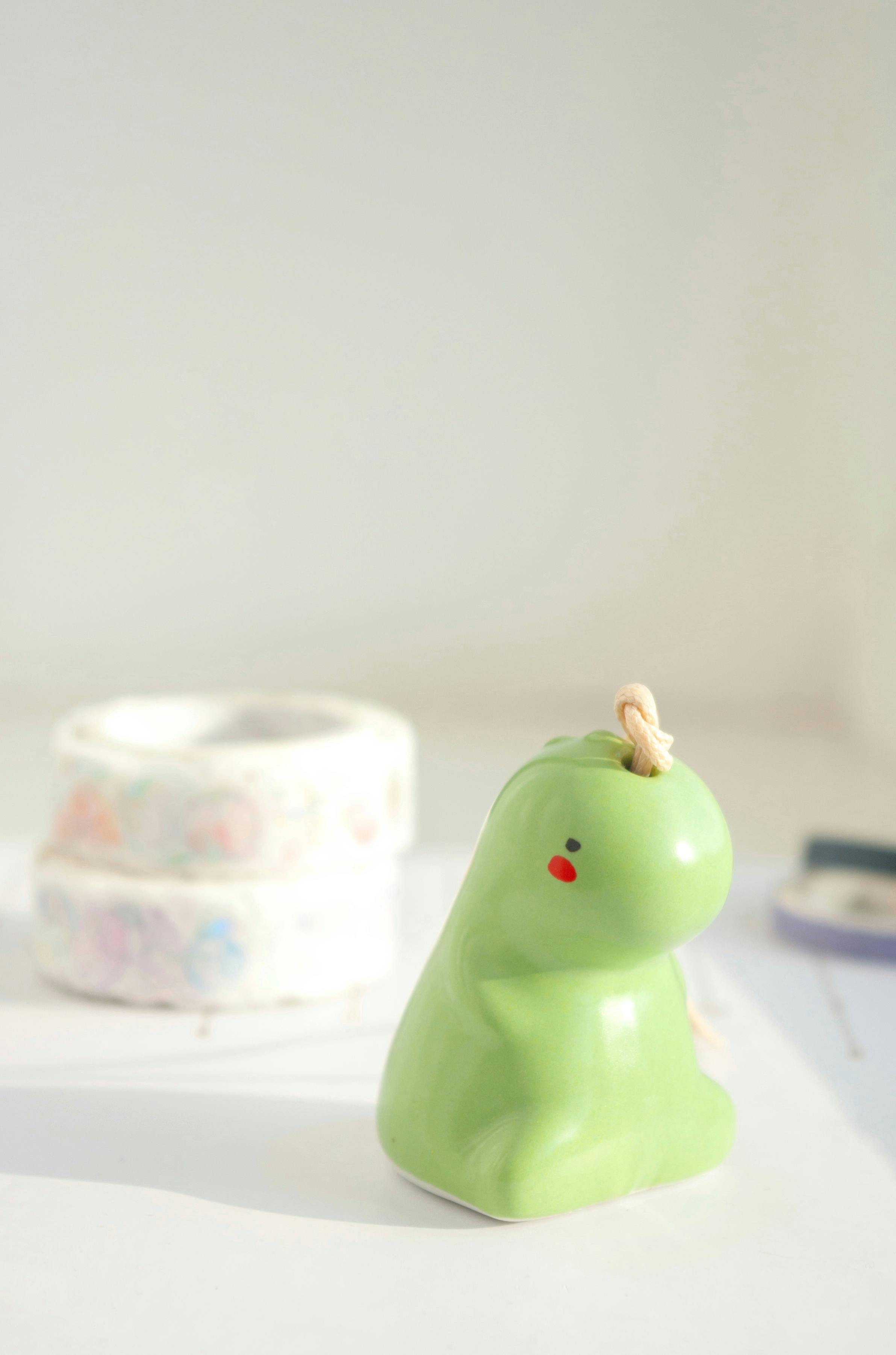 Cute Green Figurine Toy · Free Stock Photo