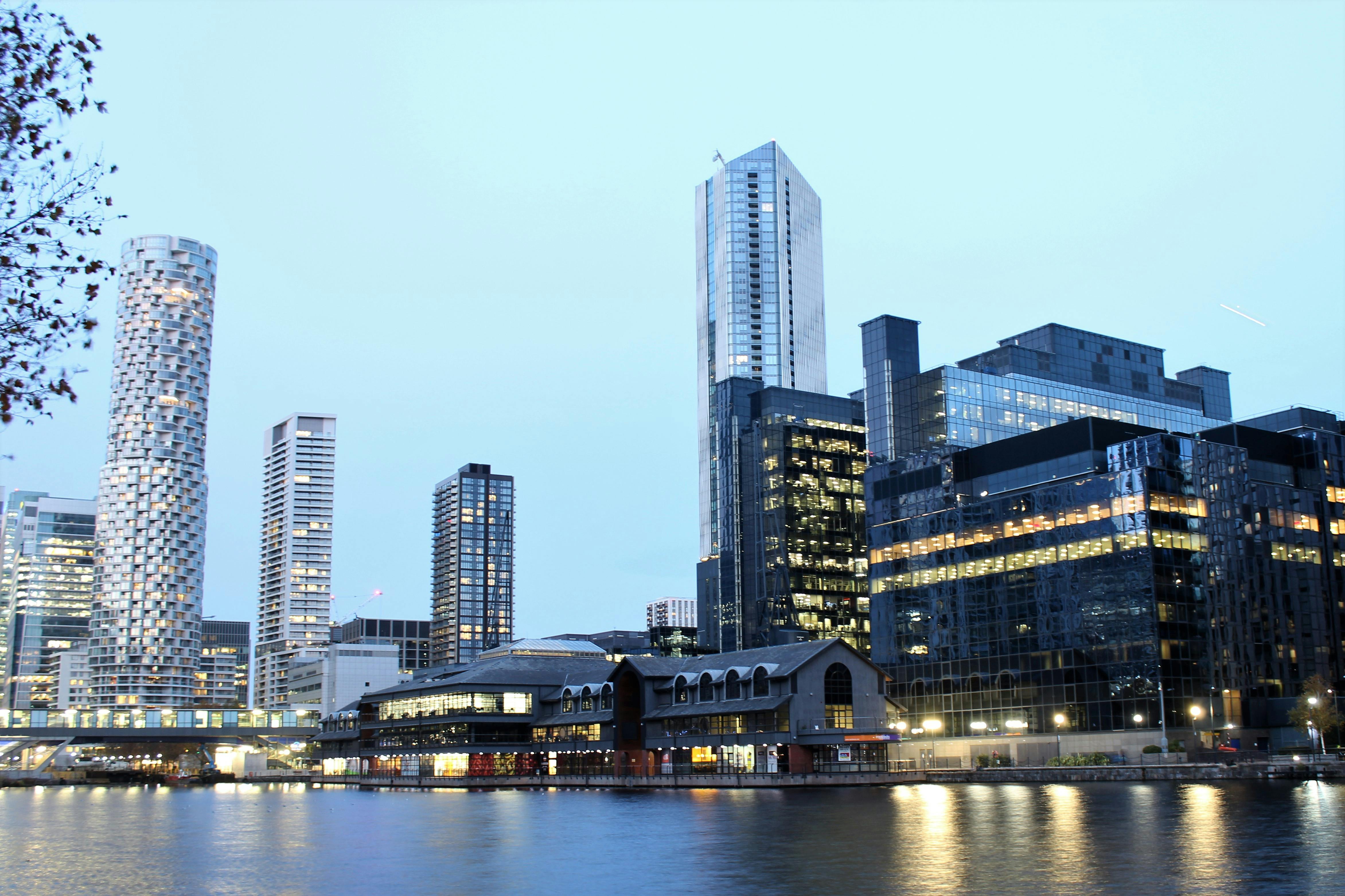 People Standing Near High-rise Building during Night Time · Free Stock ...
