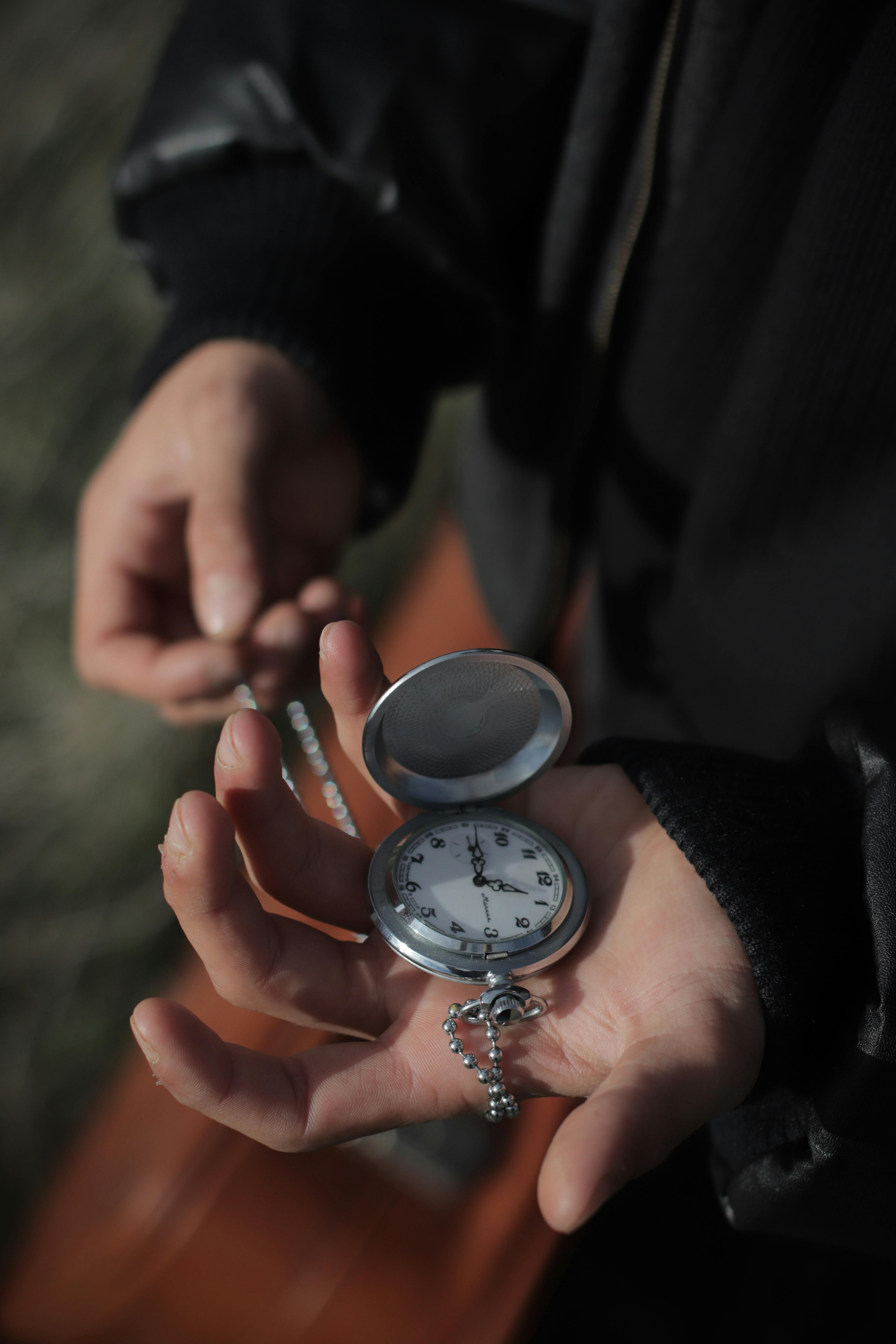 Person Holding Silver Pocket Watch · Free Stock Photo