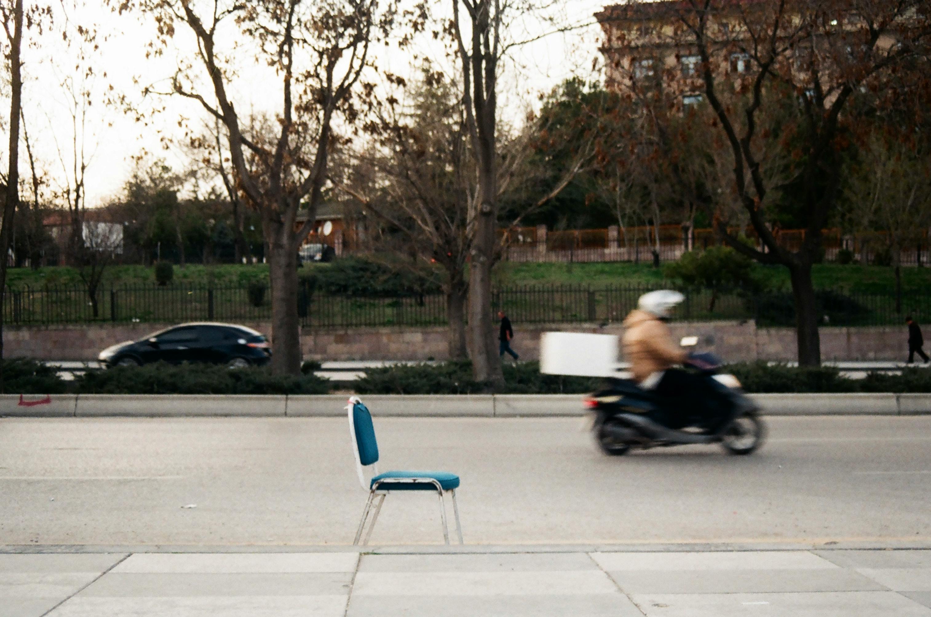 Two Person Riding Motorcycle Beside Vehicles · Free Stock Photo