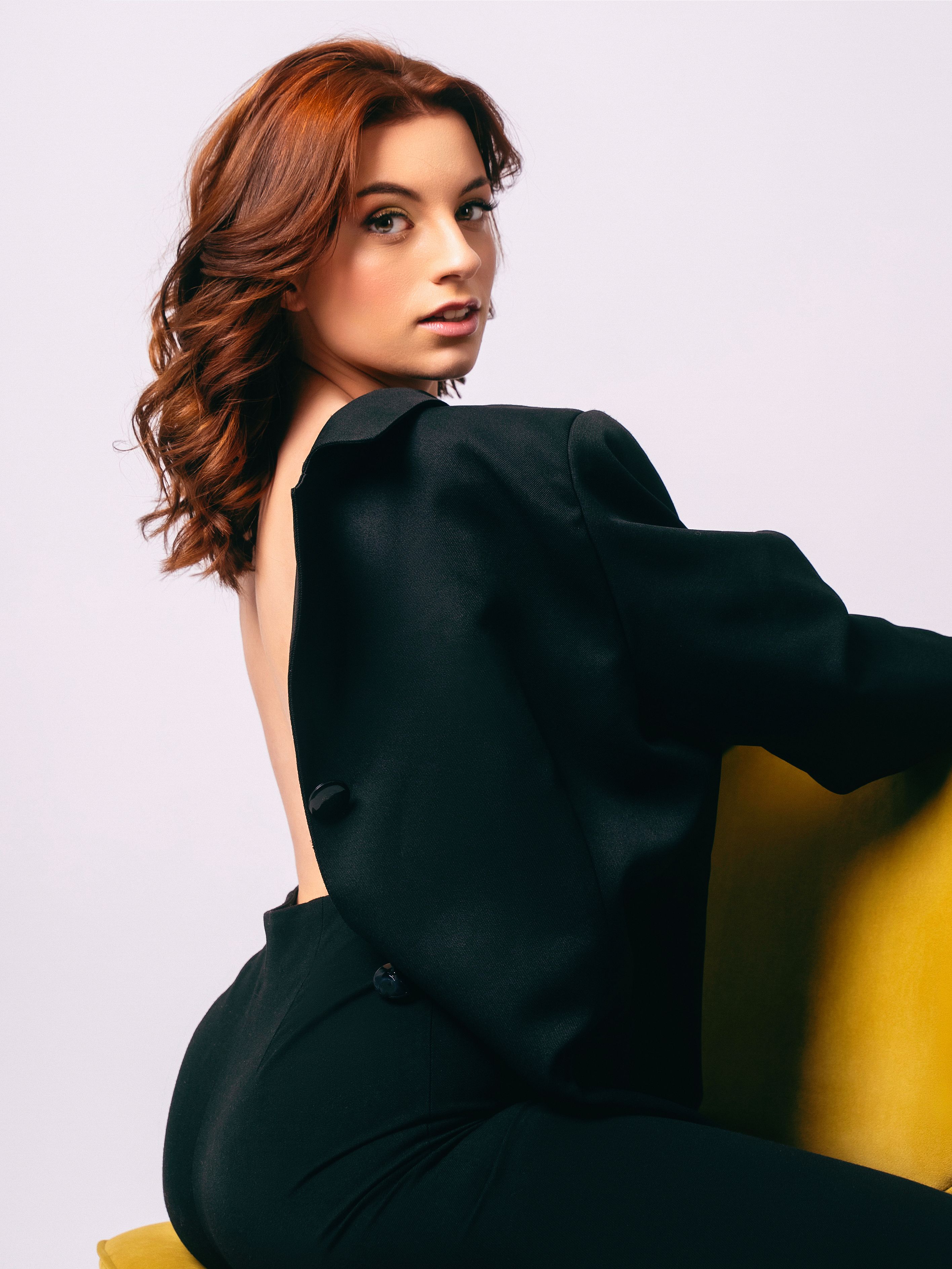 Studio Portrait of a Female Model Wearing a Fedora · Free Stock Photo