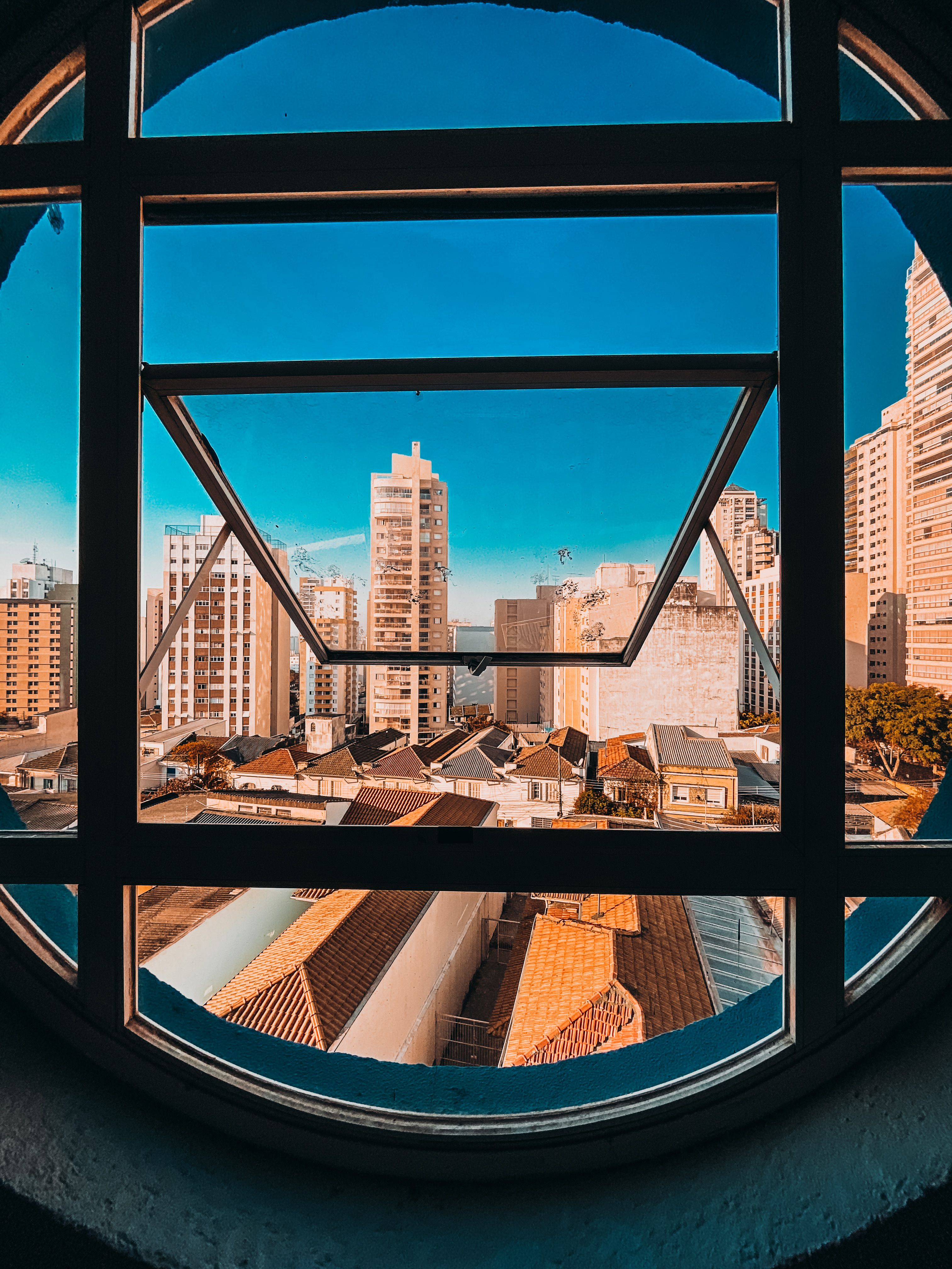A Window with a View of Buildings in a City · Free Stock Photo