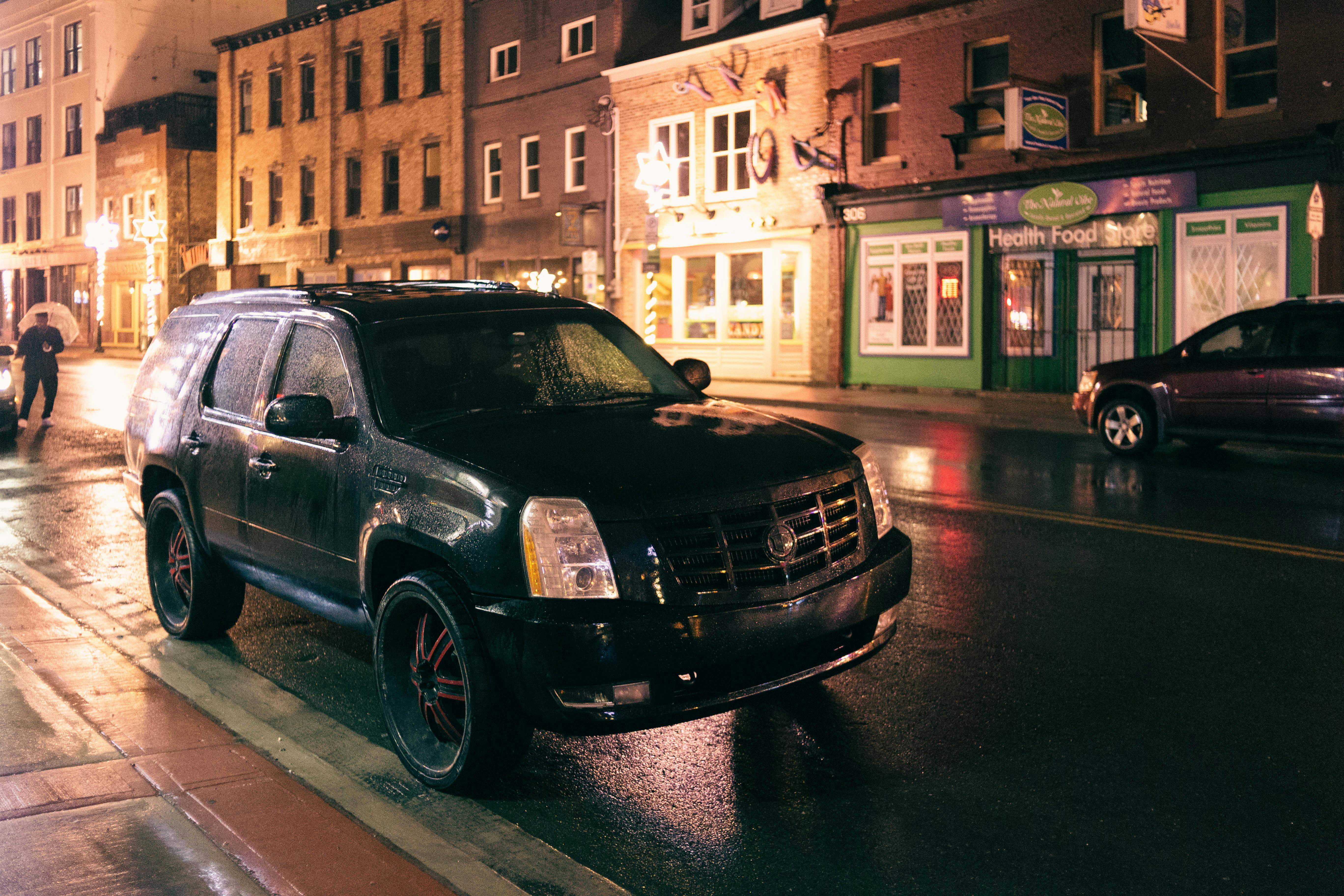 A Black SUV Parked on the Street · Free Stock Photo