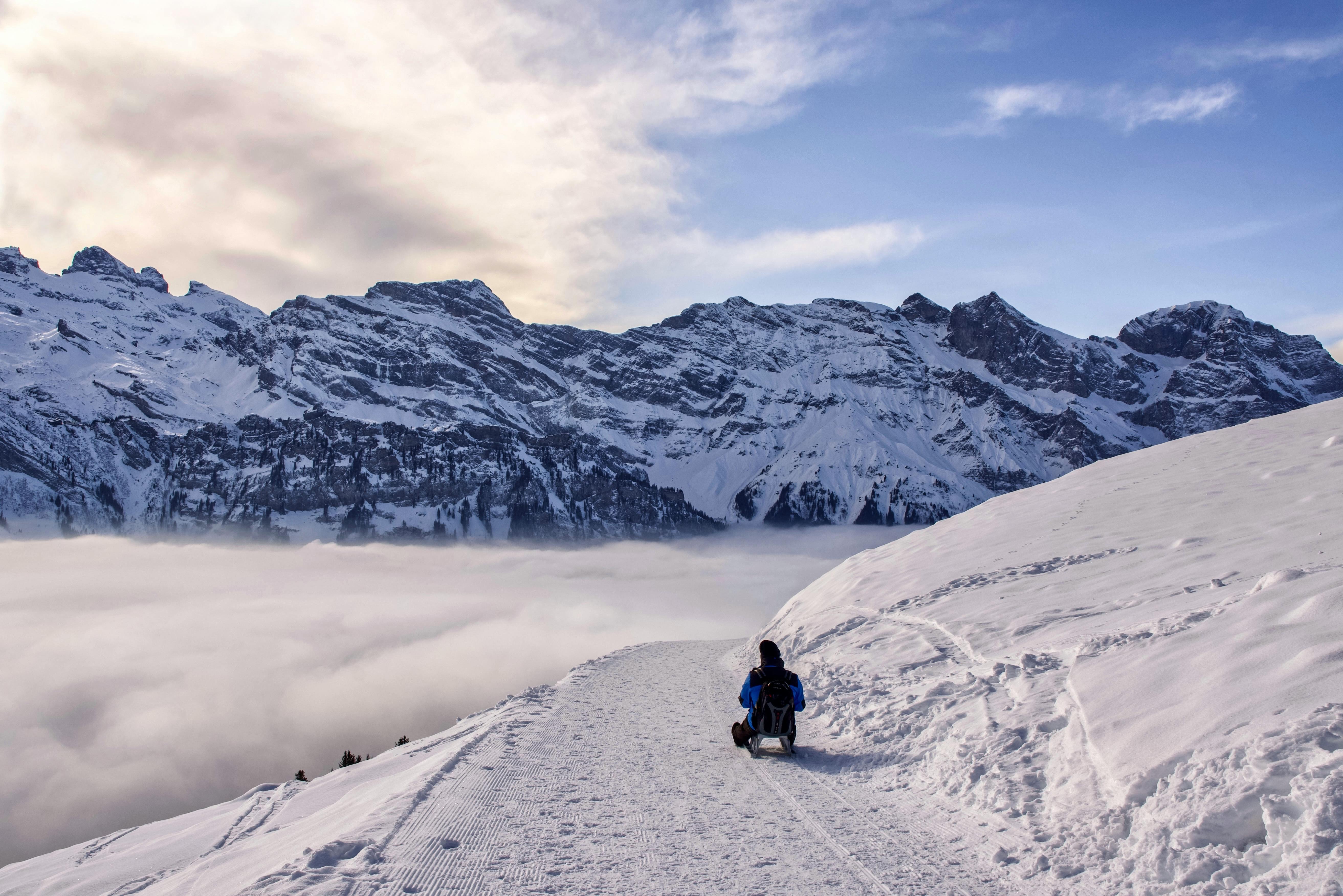 A Person Riding a Snow Sled · Free Stock Photo