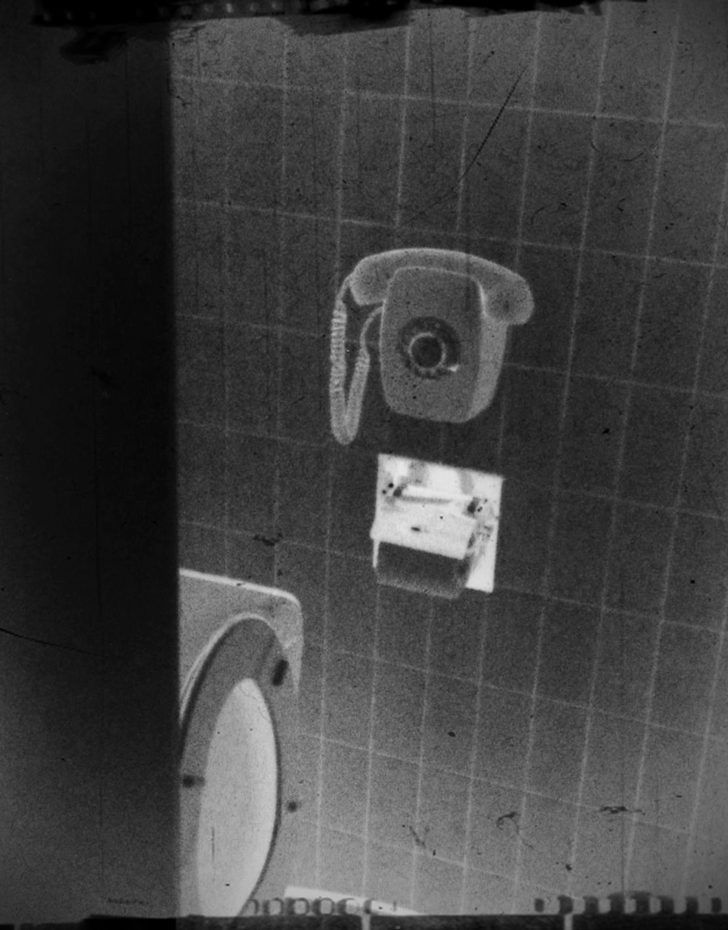 A Negative of a Telephone on a Wall · Free Stock Photo