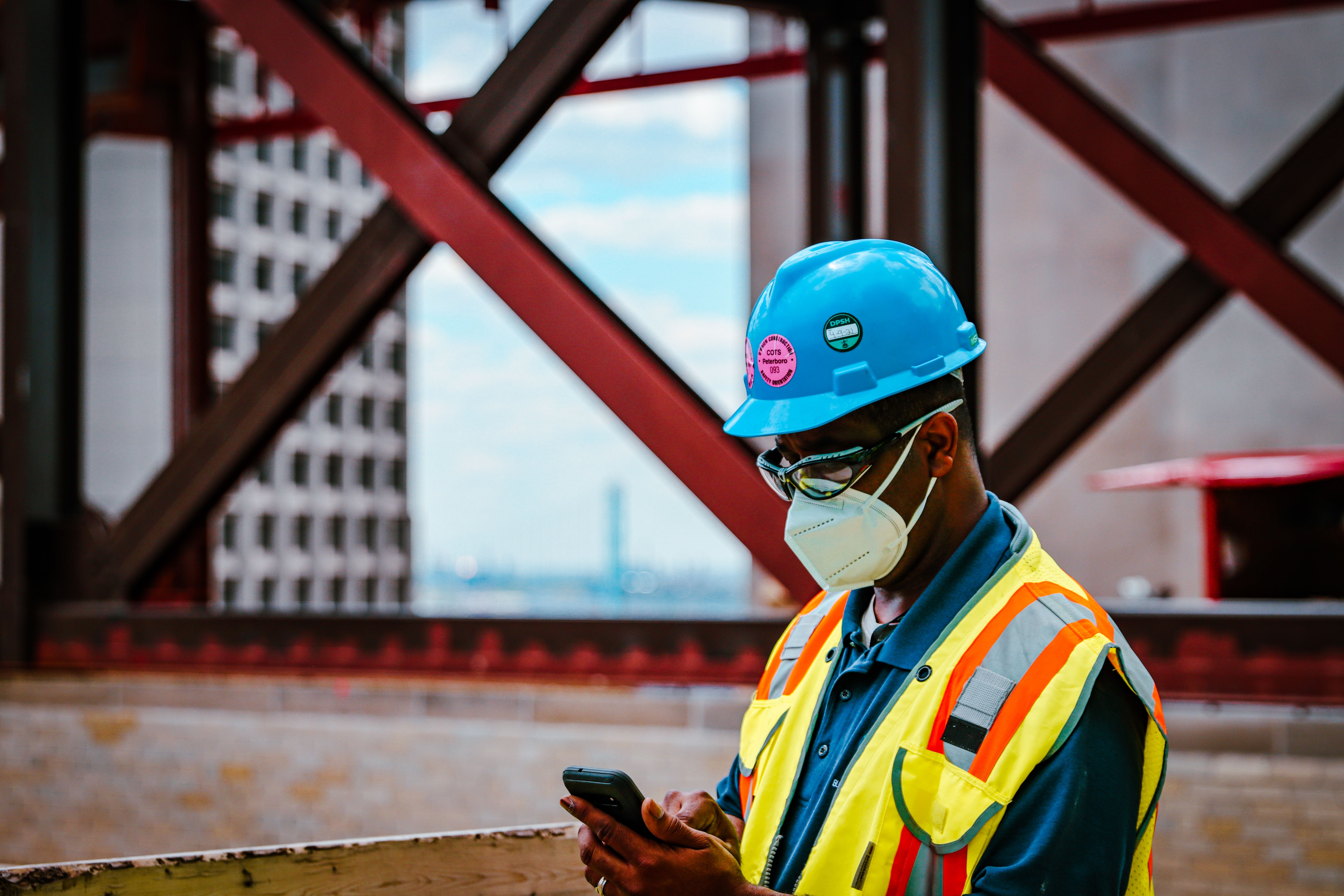 Man Wearing Safety vest Looking at the Ceiling · Free Stock Photo