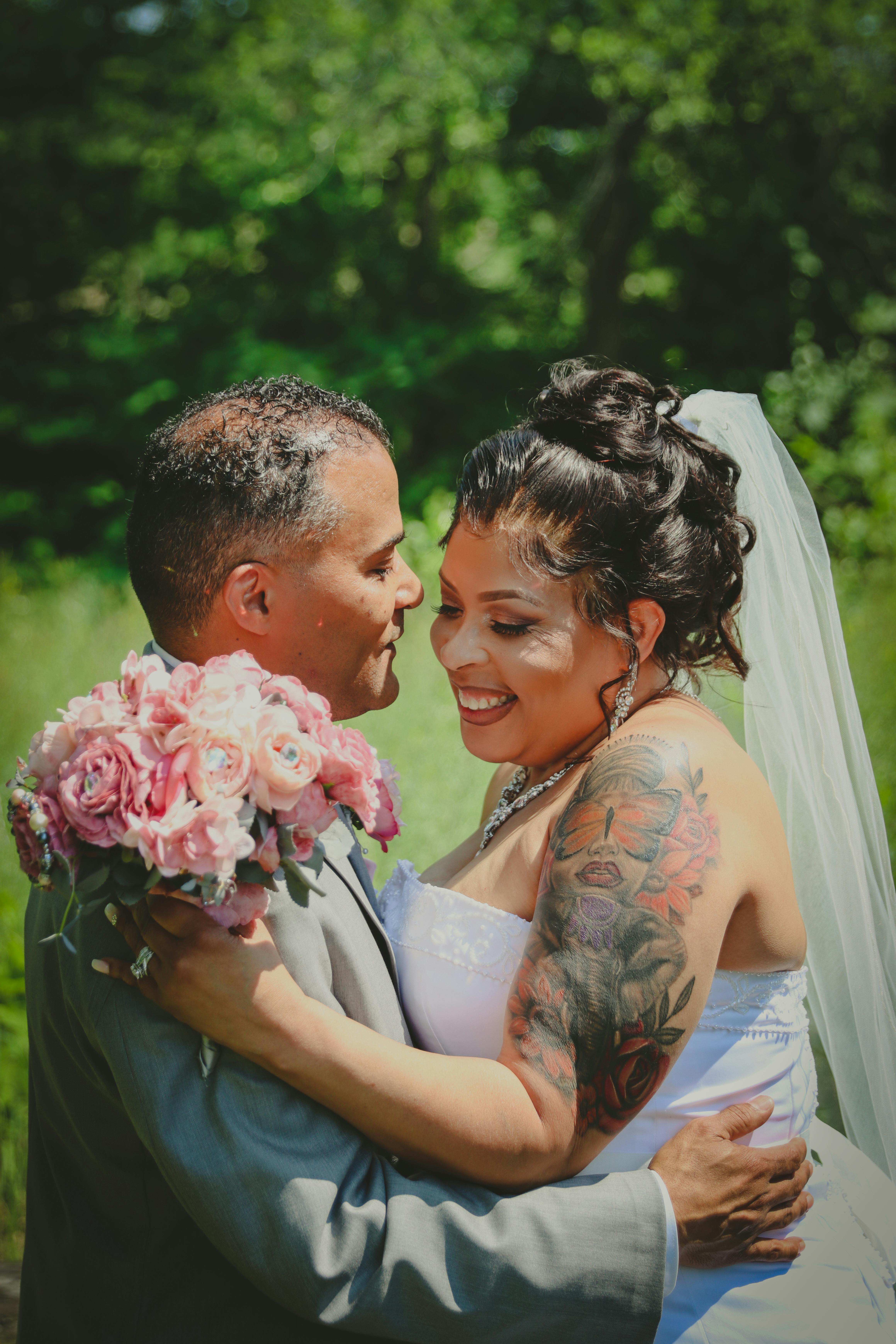 Newlywed Couple Kissing while Sitting on the Edge of a Cliff · Free ...
