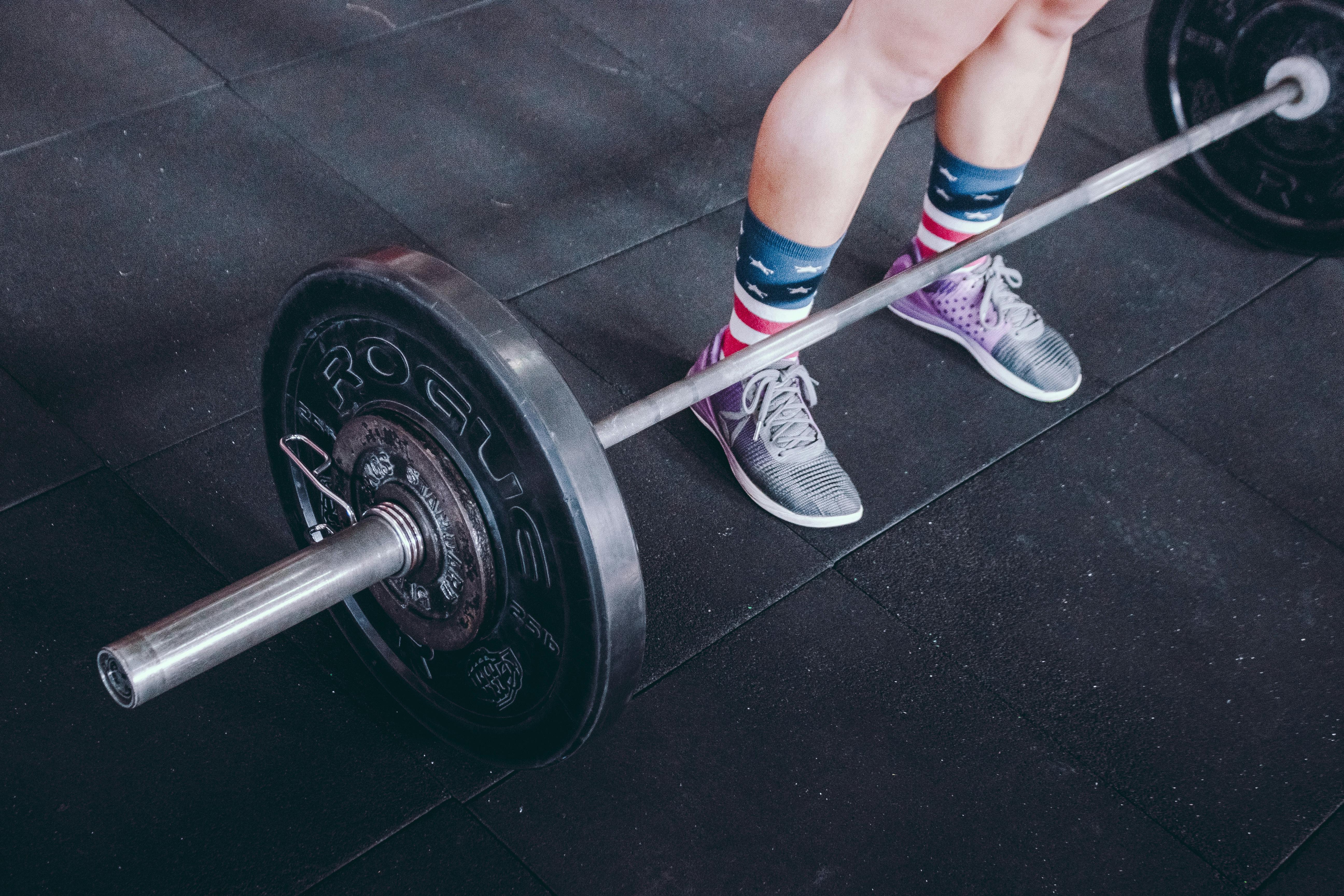 Person Lifting Barbell · Free Stock Photo