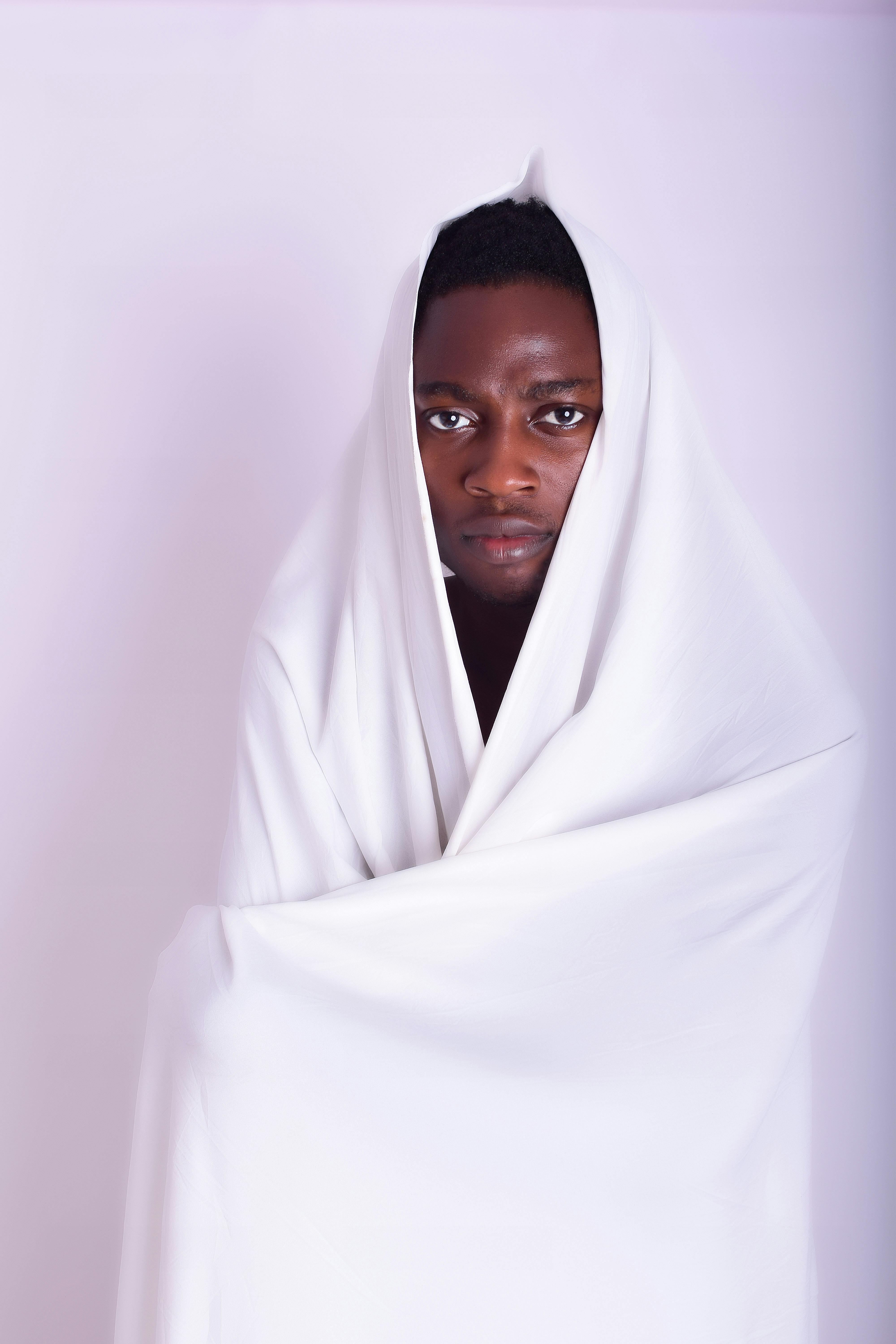 Person Covering His Body with White Blanket · Free Stock Photo