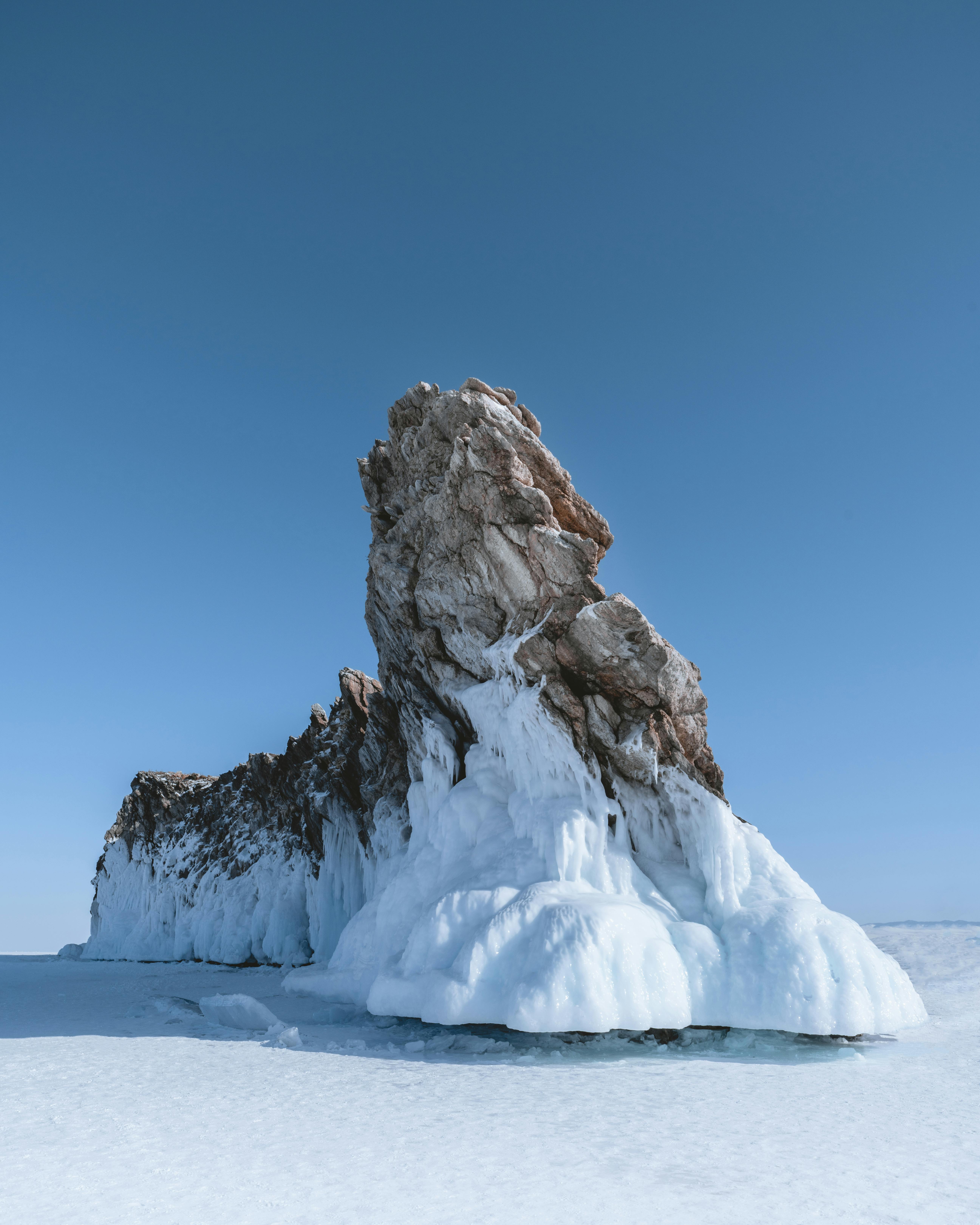 Frozen Rock Formations on Snow Covered Ground · Free Stock Photo