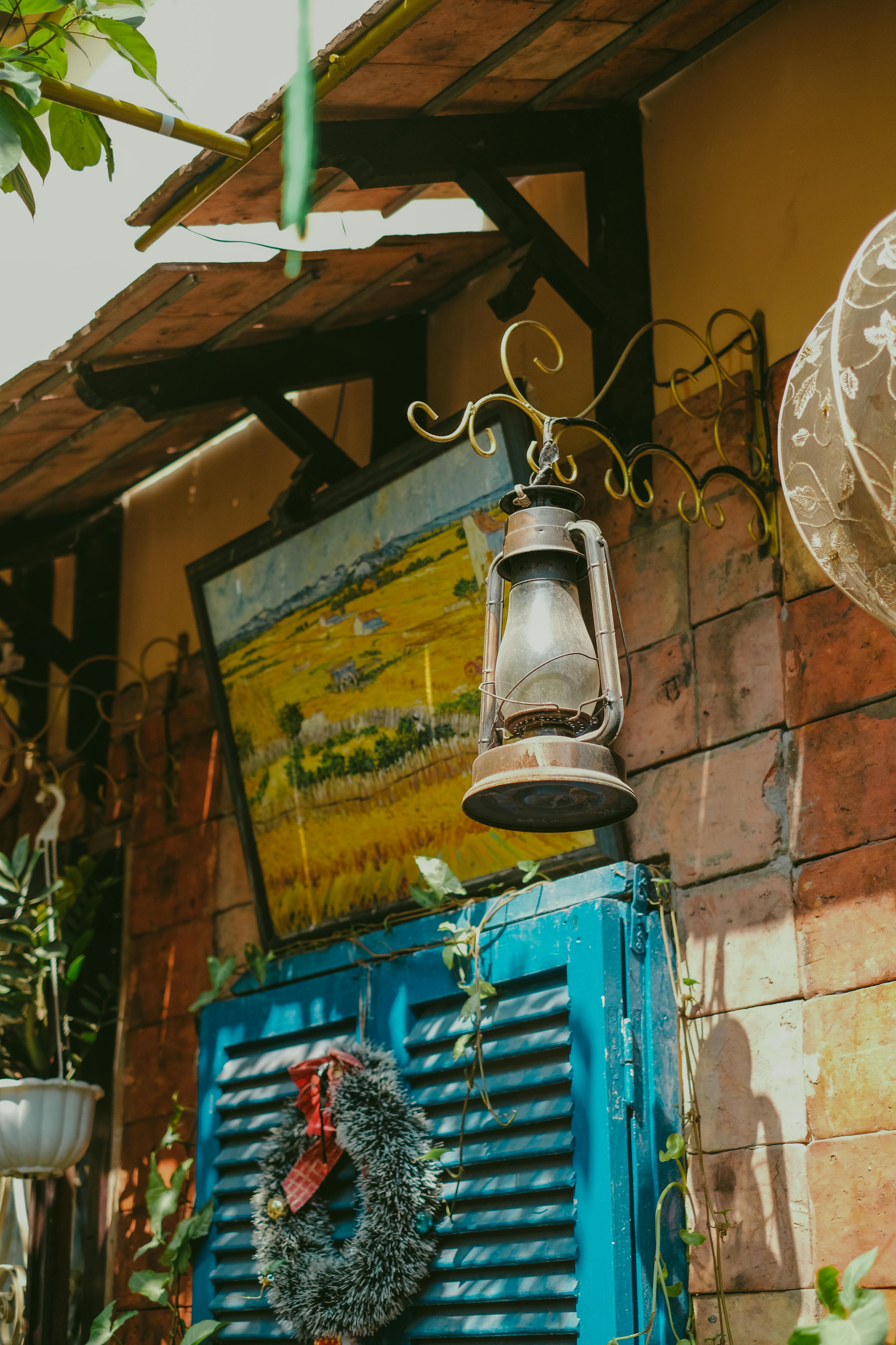 A Dusty Lamp Hanging on a Wall · Free Stock Photo