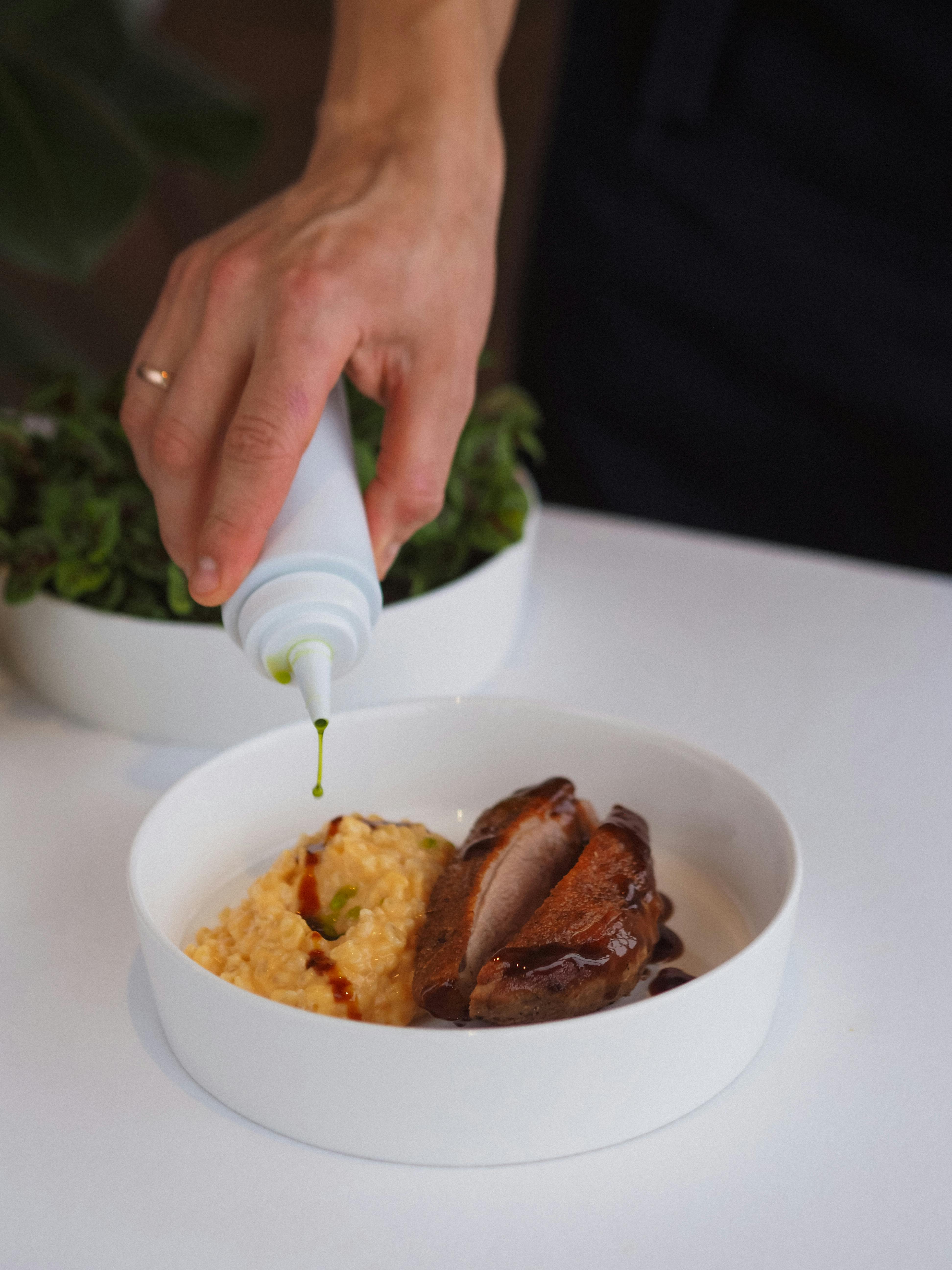 Woman Hand Dressing Meal · Free Stock Photo