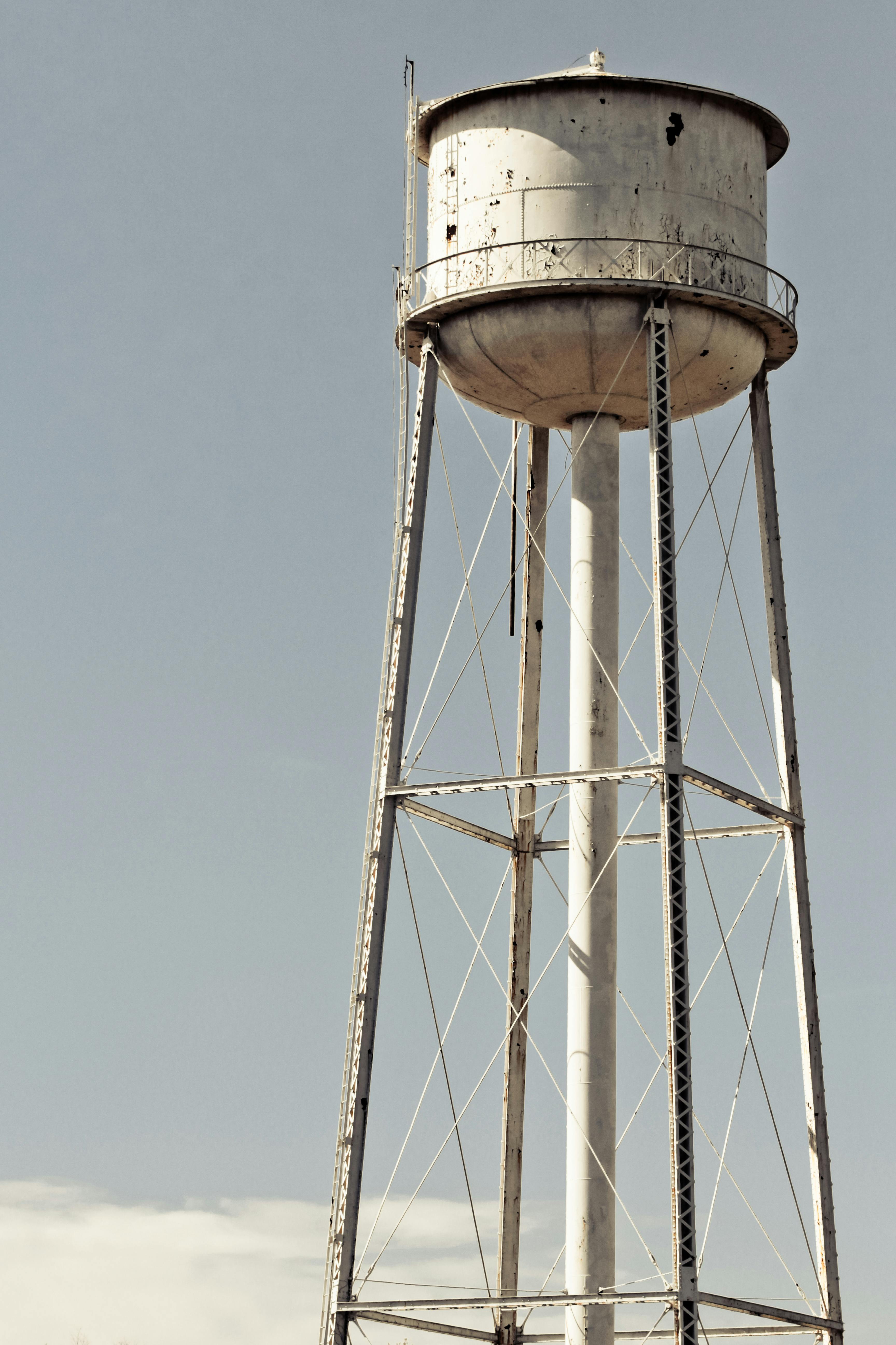 A Photo of Abandoned Water Tank Tower on Farmland · Free Stock Photo