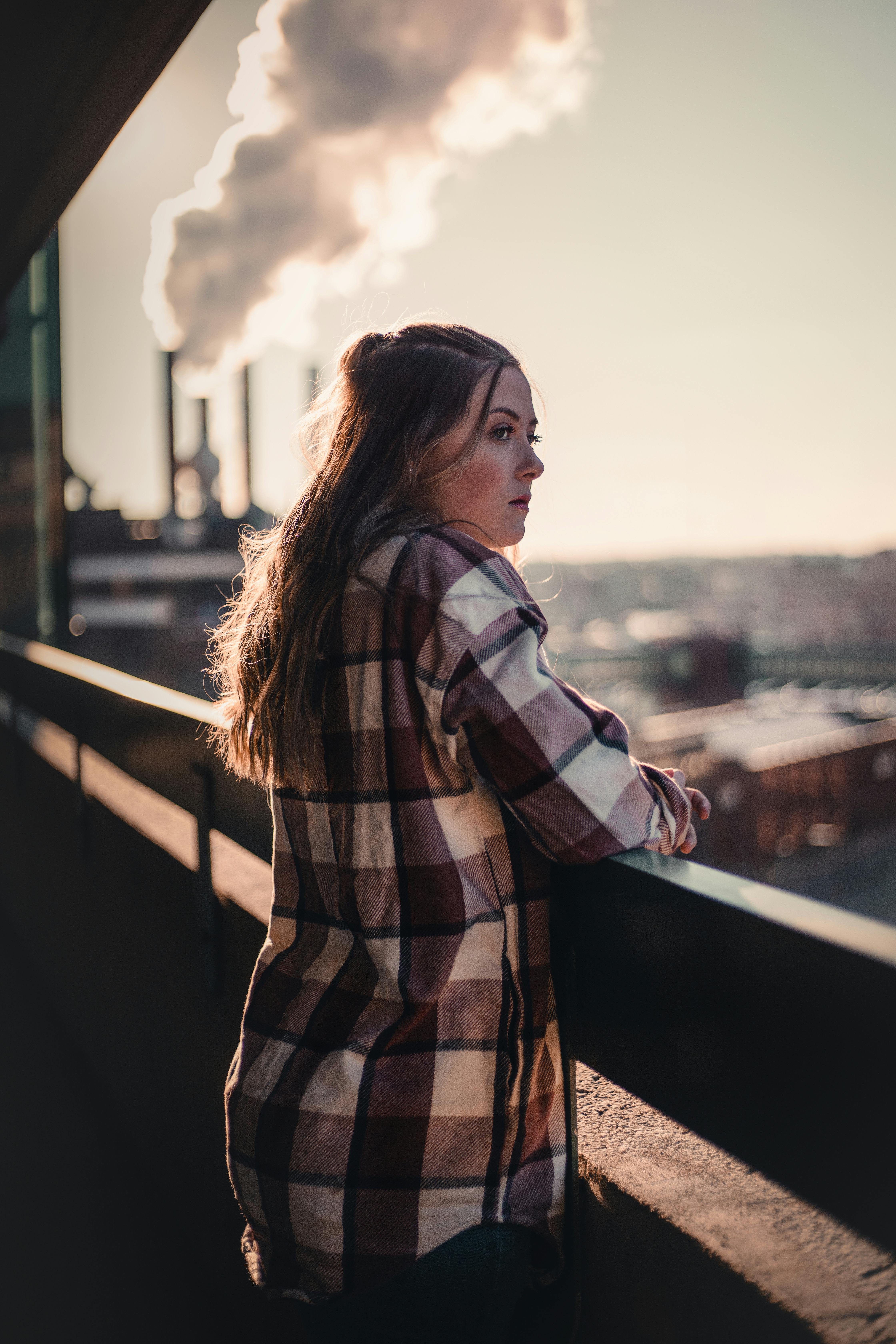 Woman Leaning on a Railing · Free Stock Photo