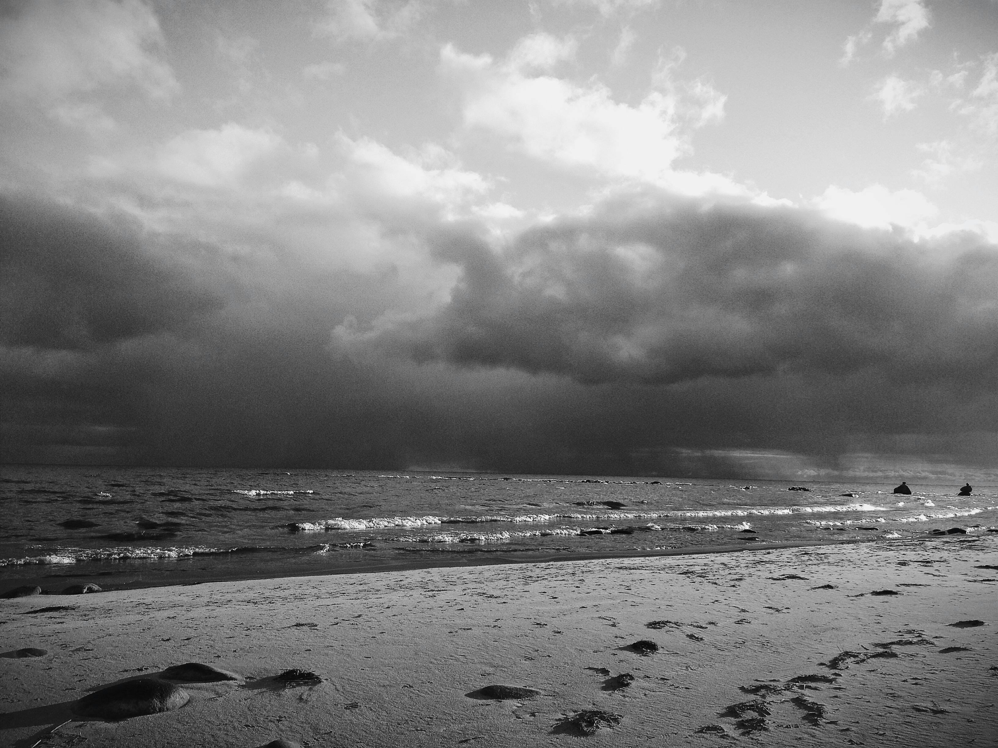 Grayscale Photo of a Beach · Free Stock Photo