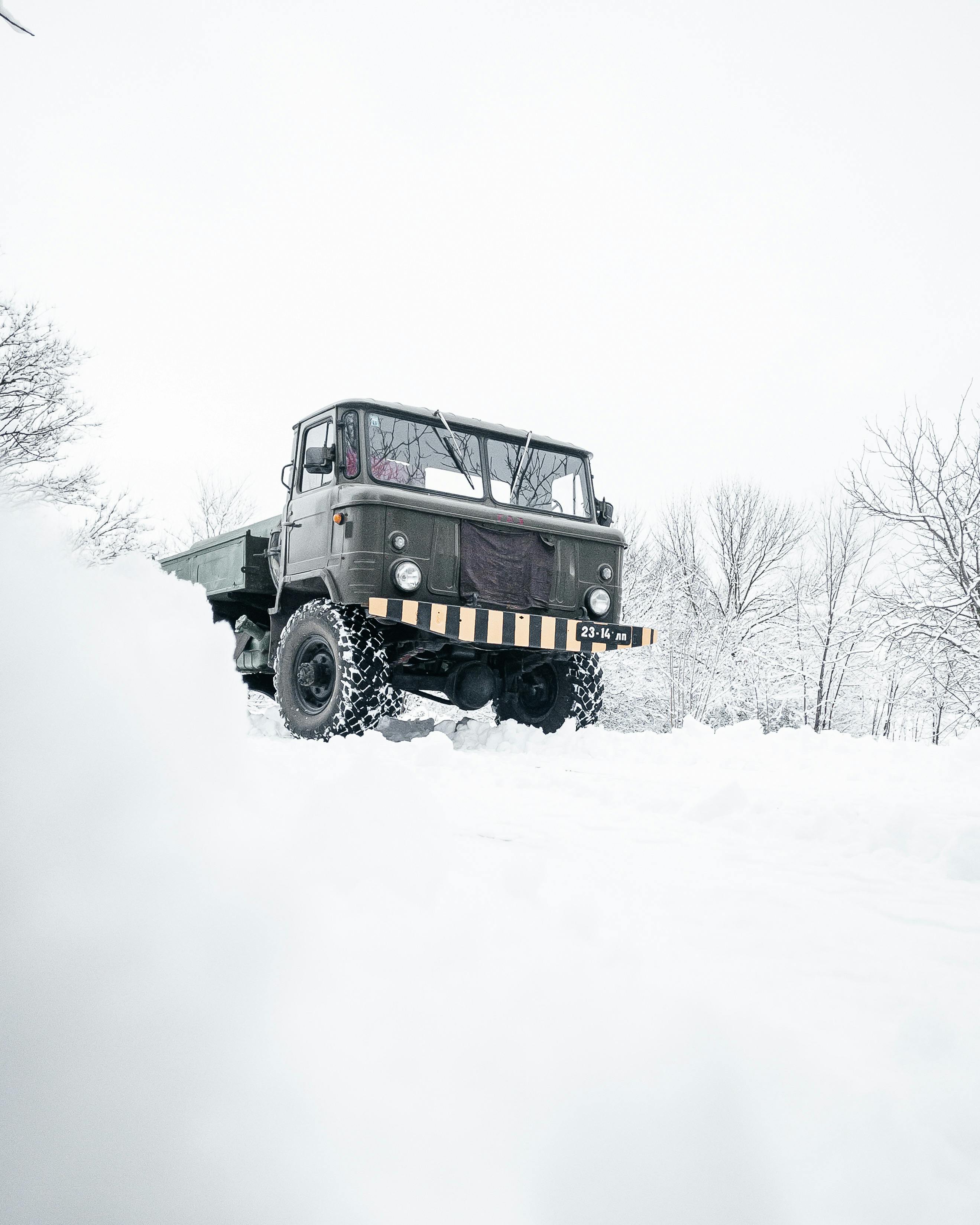 A Winter Service Vehicle Plowing the Snow on the Street · Free Stock Photo