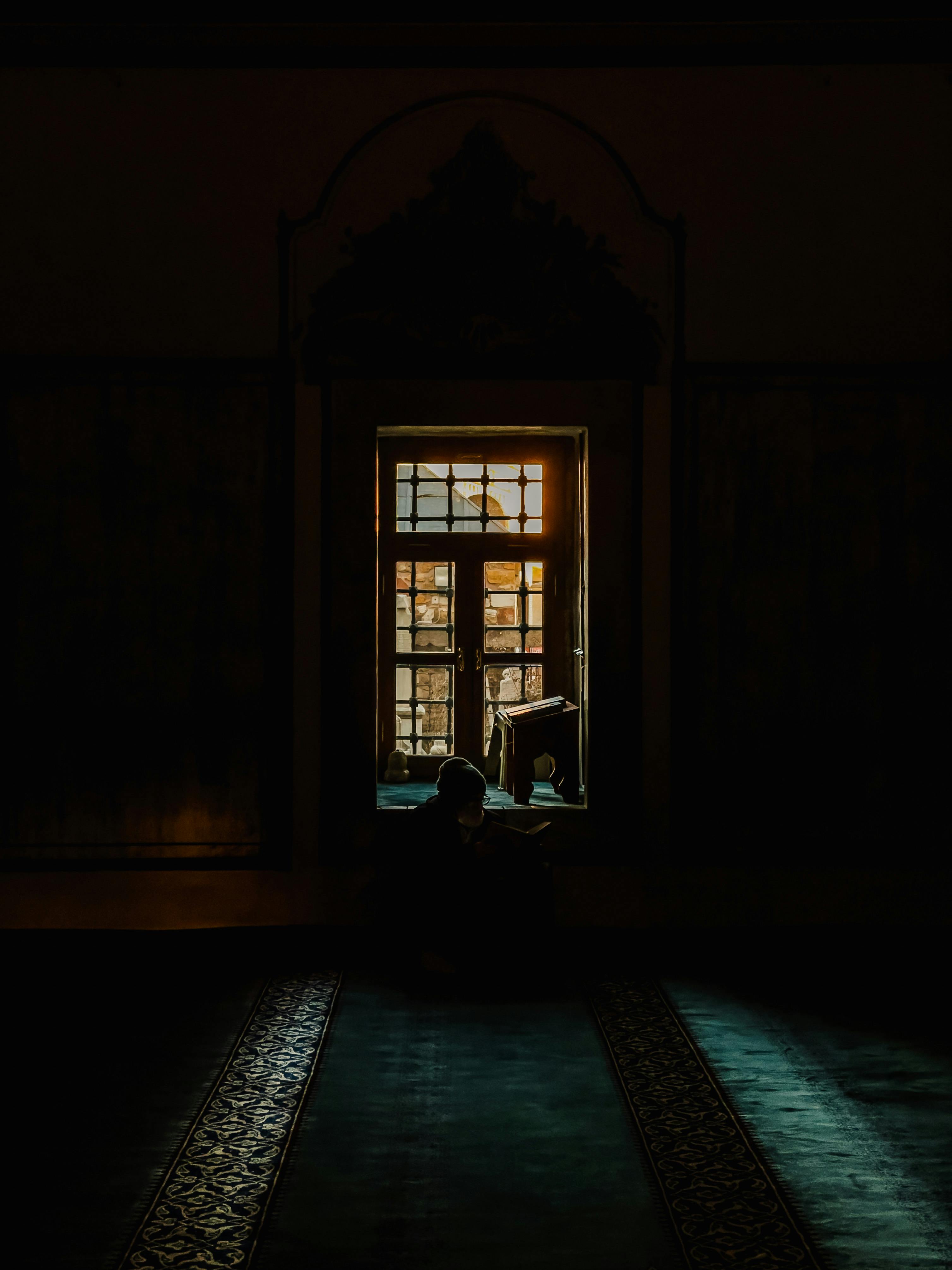 A Person Sitting Beside the Window · Free Stock Photo