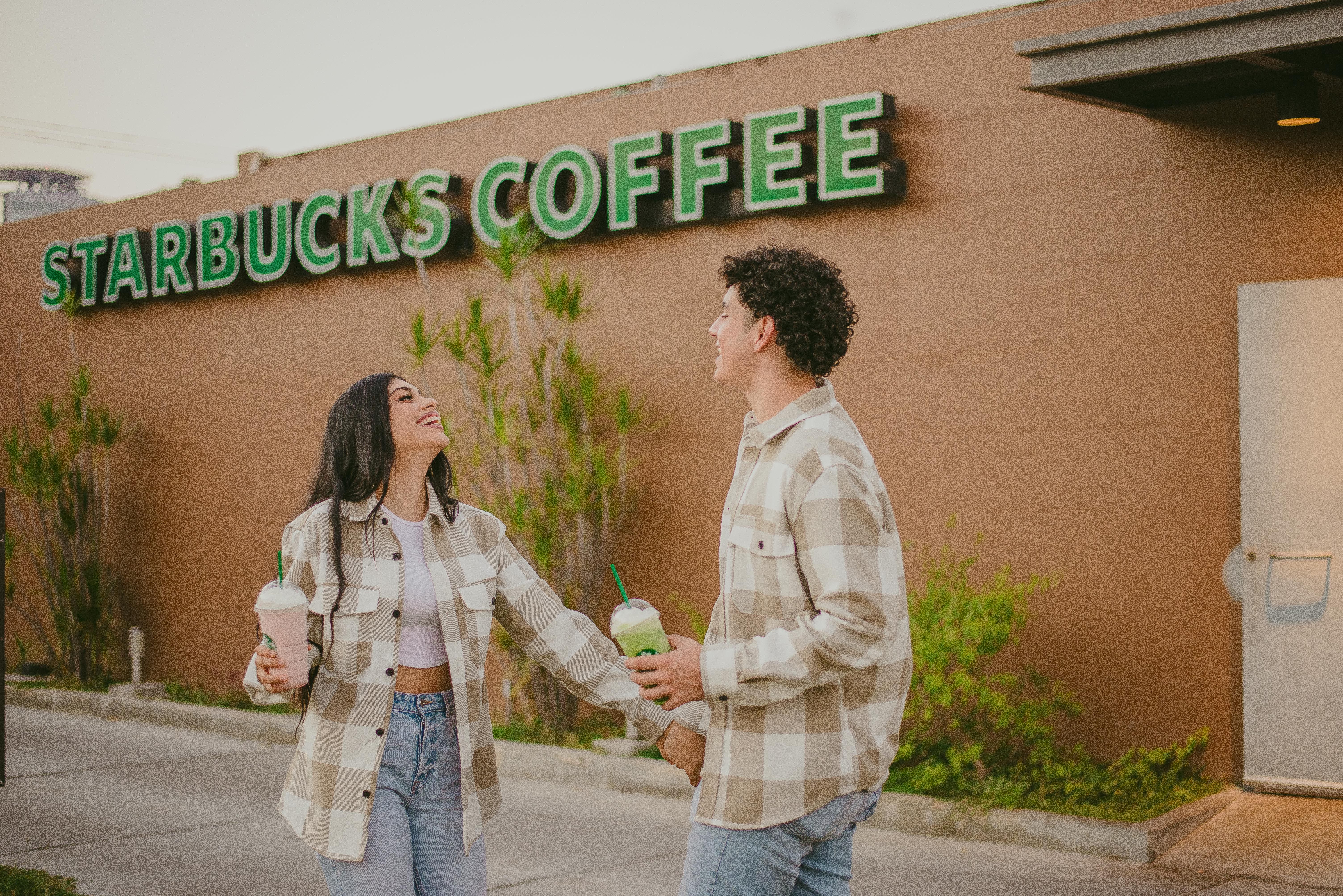 Romantic Couple in Starbucks Coffee Shop · Free Stock Photo