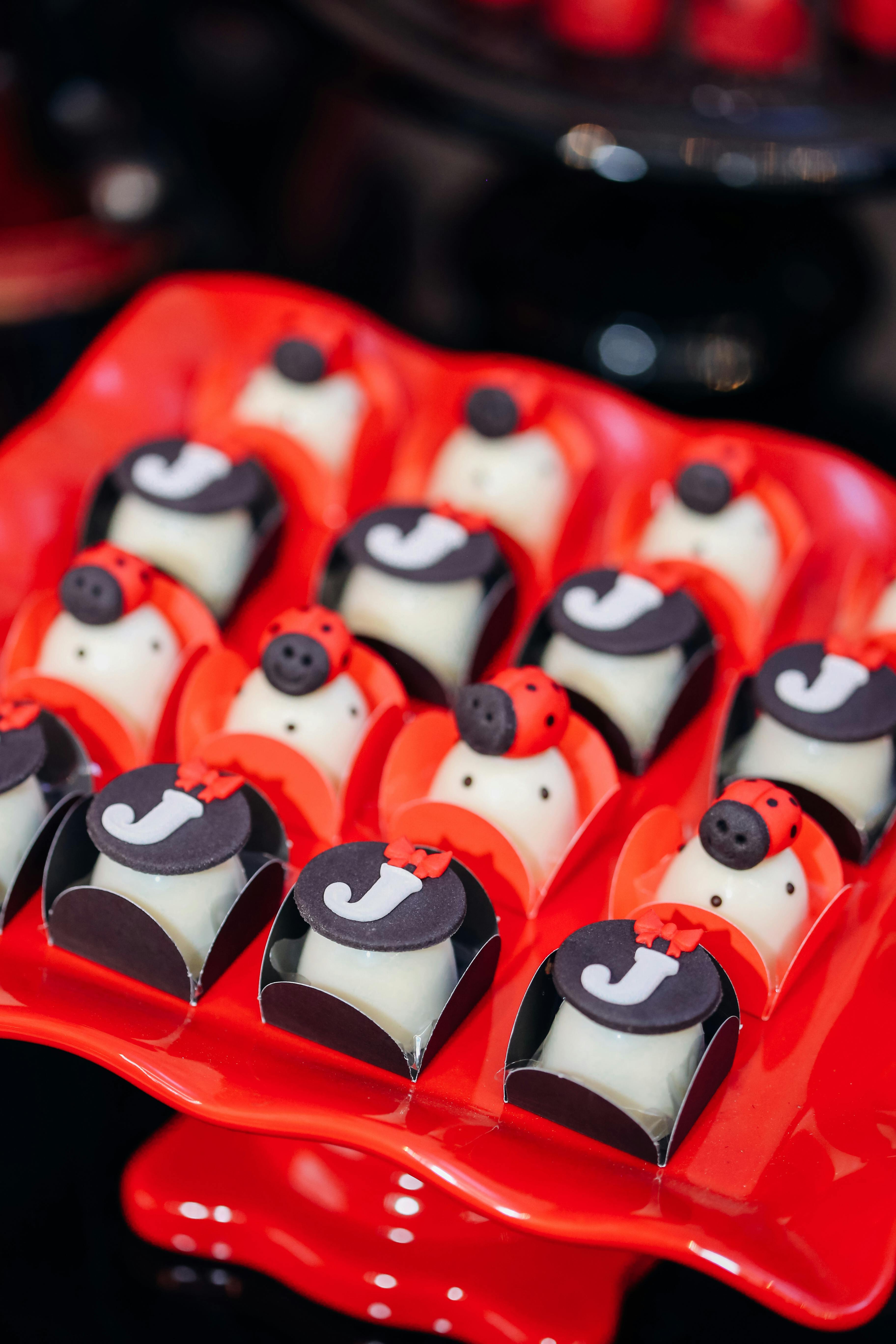 Hands Wearing Black Gloves Making Candies · Free Stock Photo
