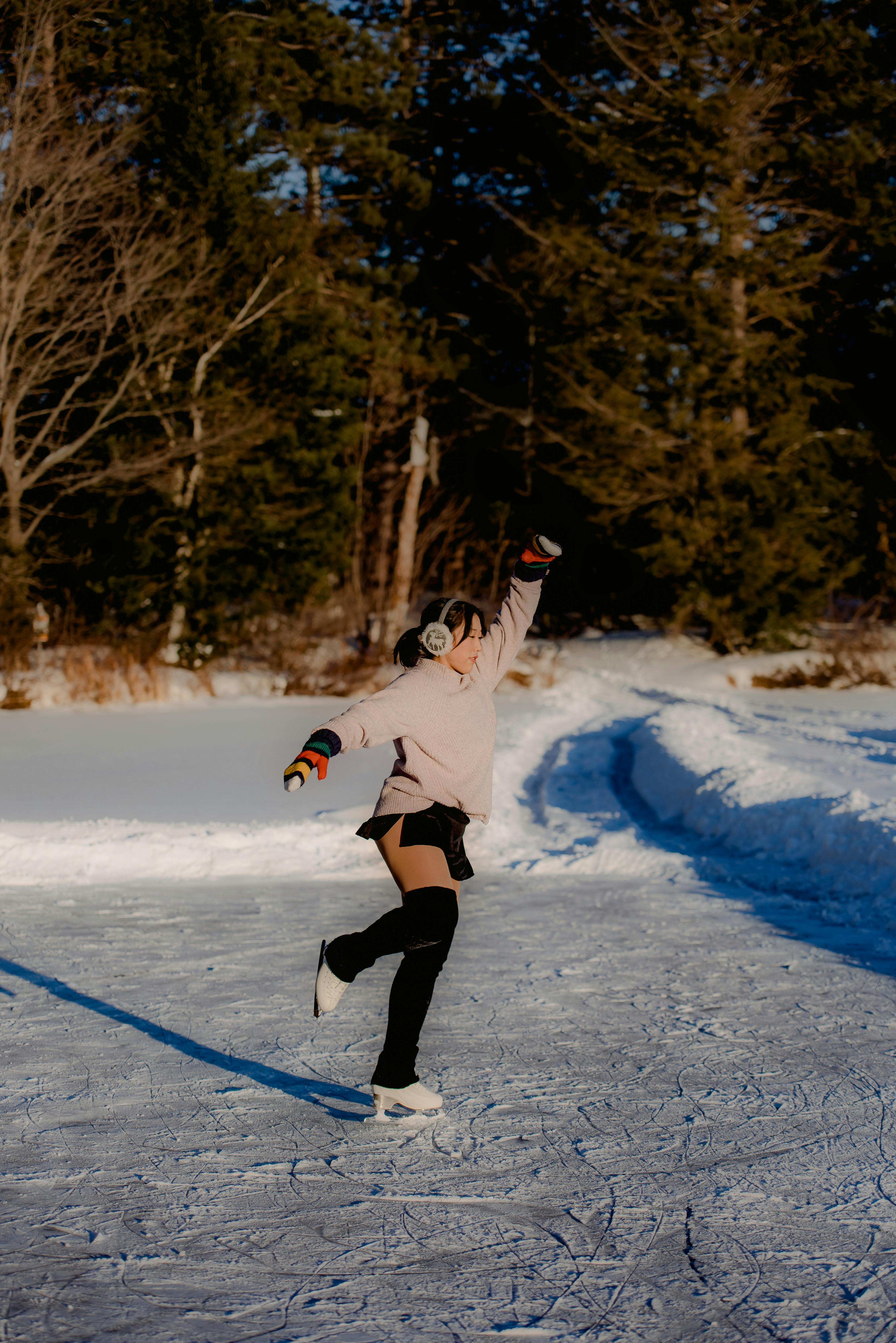 Woman Ice Skating on Frozen Lake · Free Stock Photo