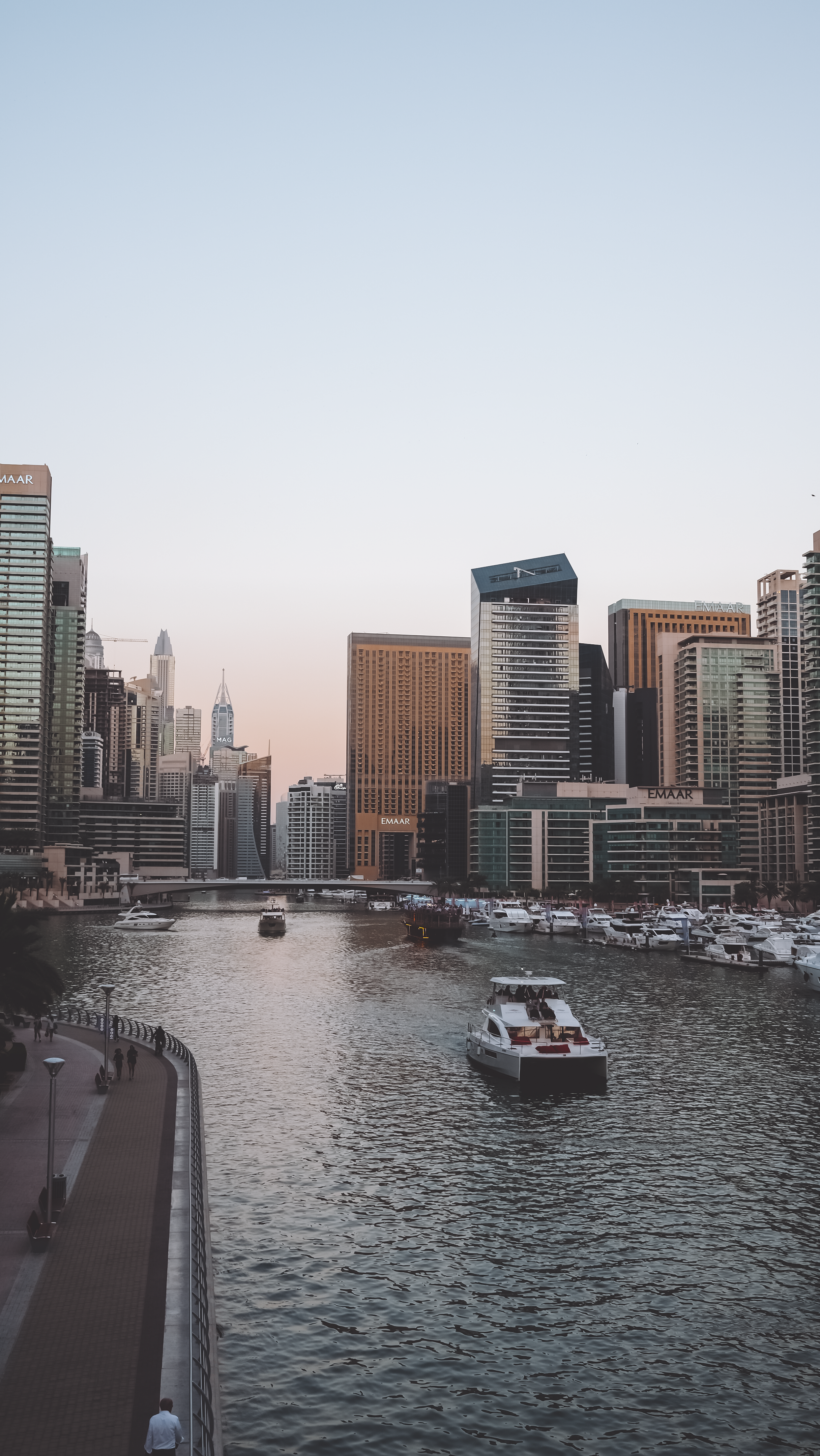 A Sailing Boat on Water Near City Buildings · Free Stock Photo