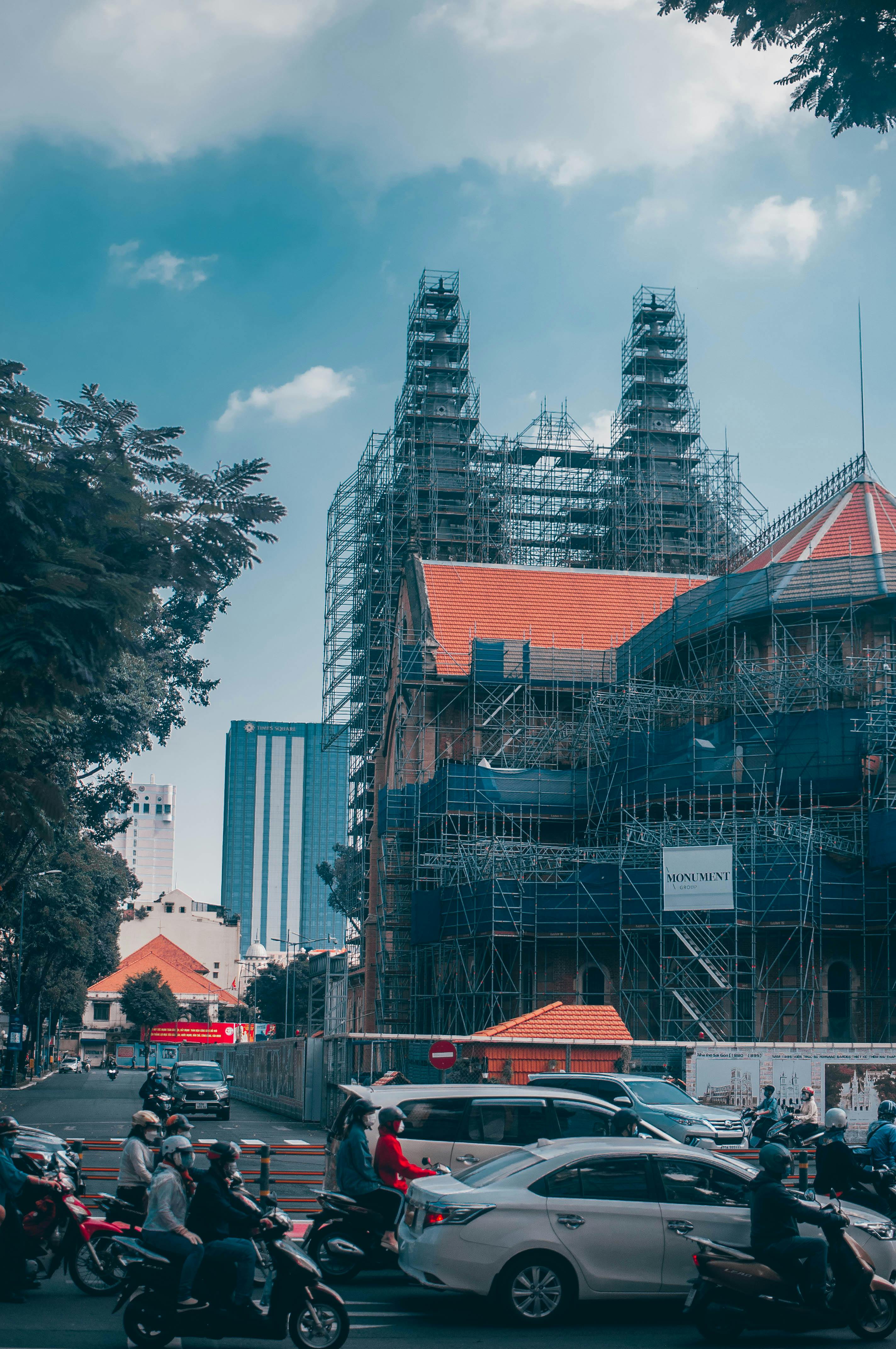 A Moving Cars and Motorcycles Passing on an Under Construction Building ...