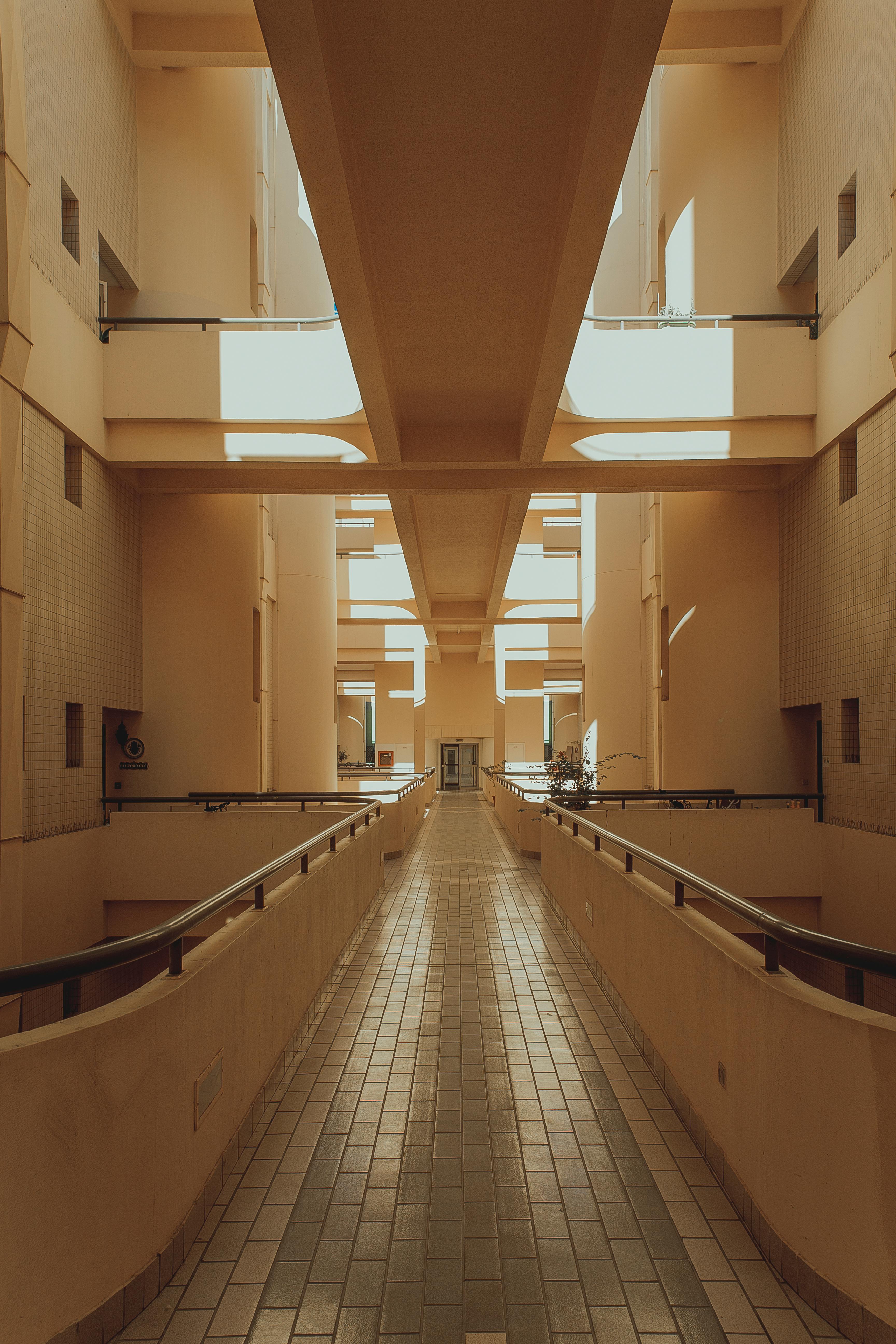 Building Hallway on Ceramic Tiled Floor · Free Stock Photo