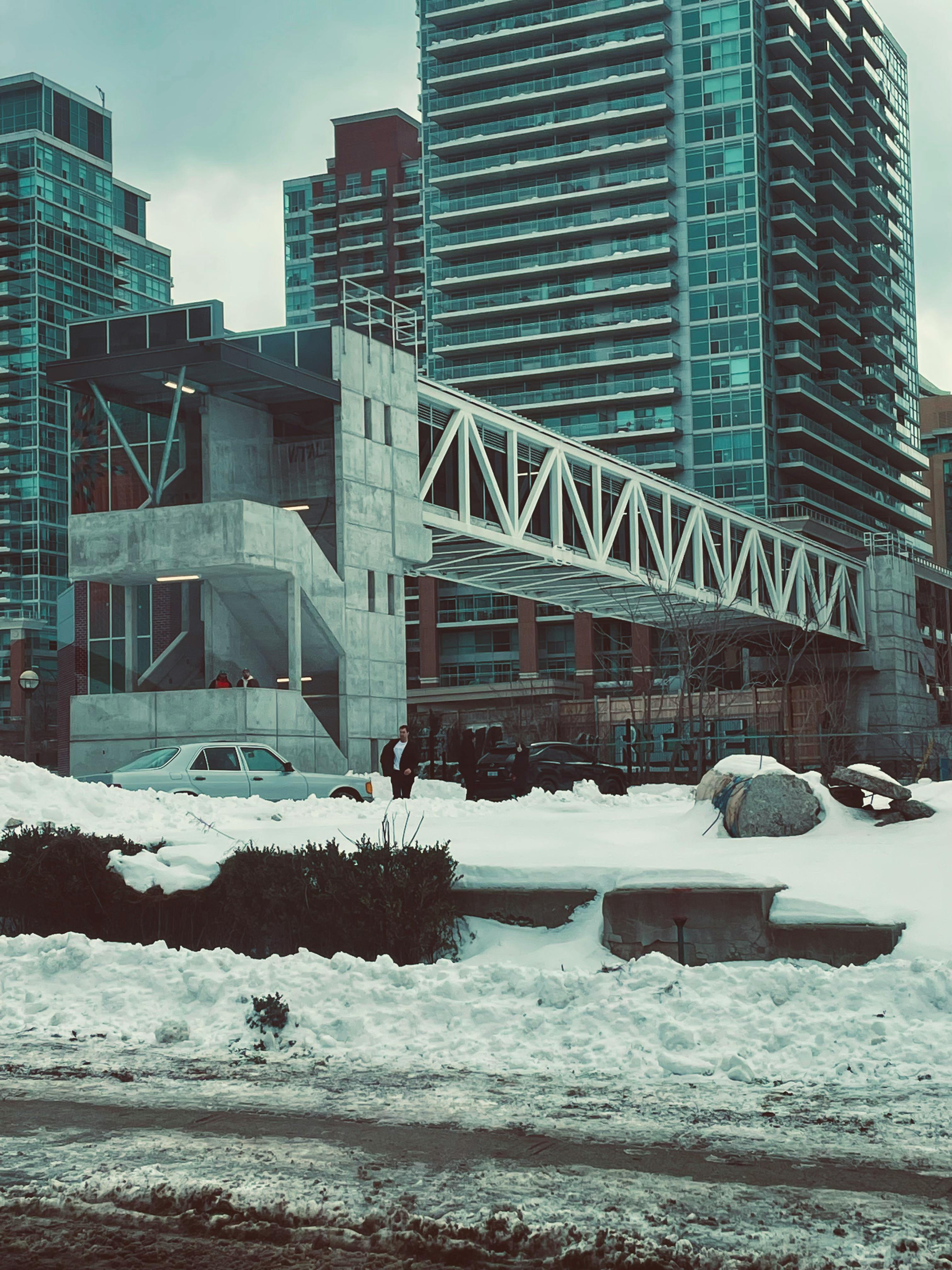 Overpass Bridge Beside a Building · Free Stock Photo