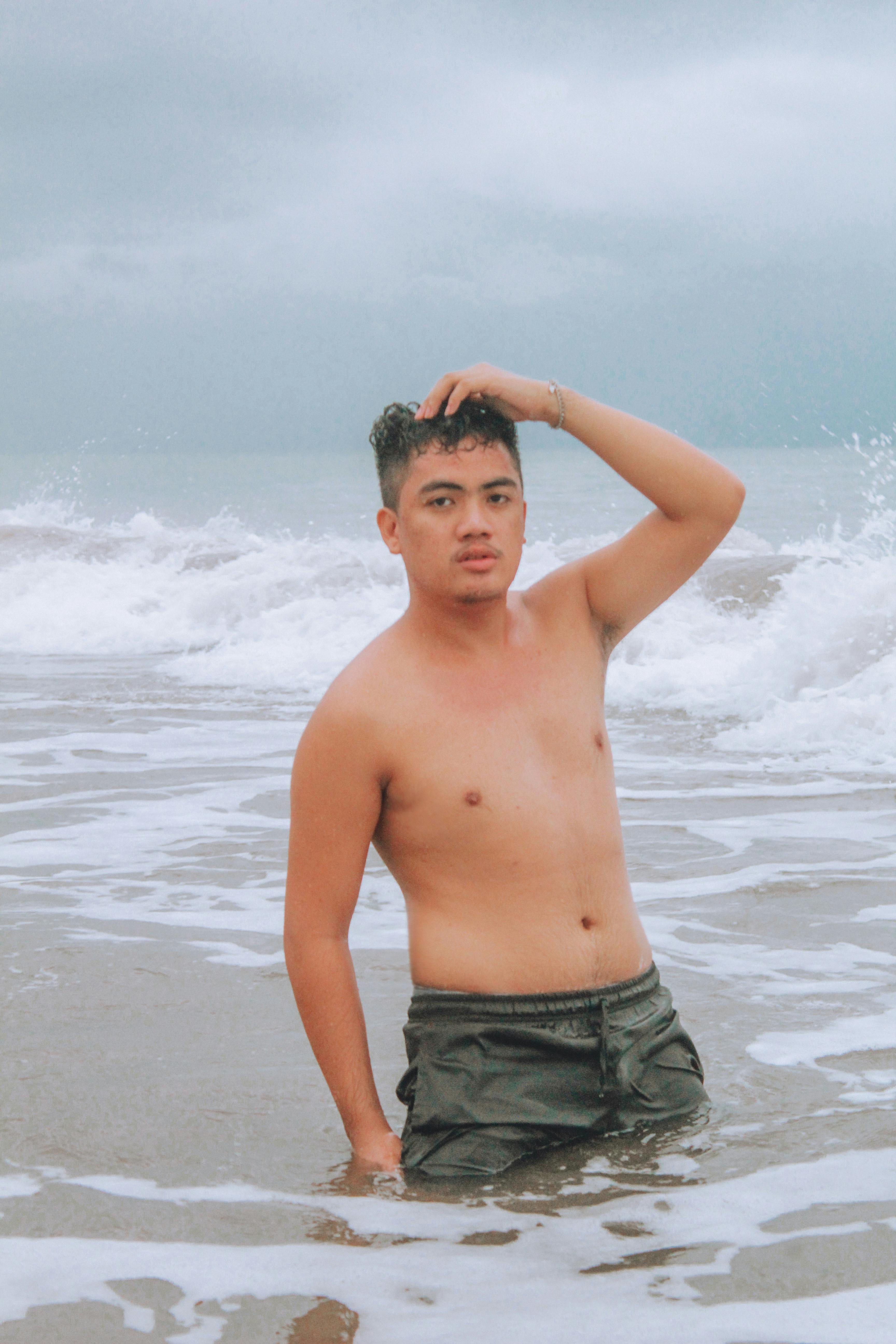 Shirtless Man Posing in Water · Free Stock Photo