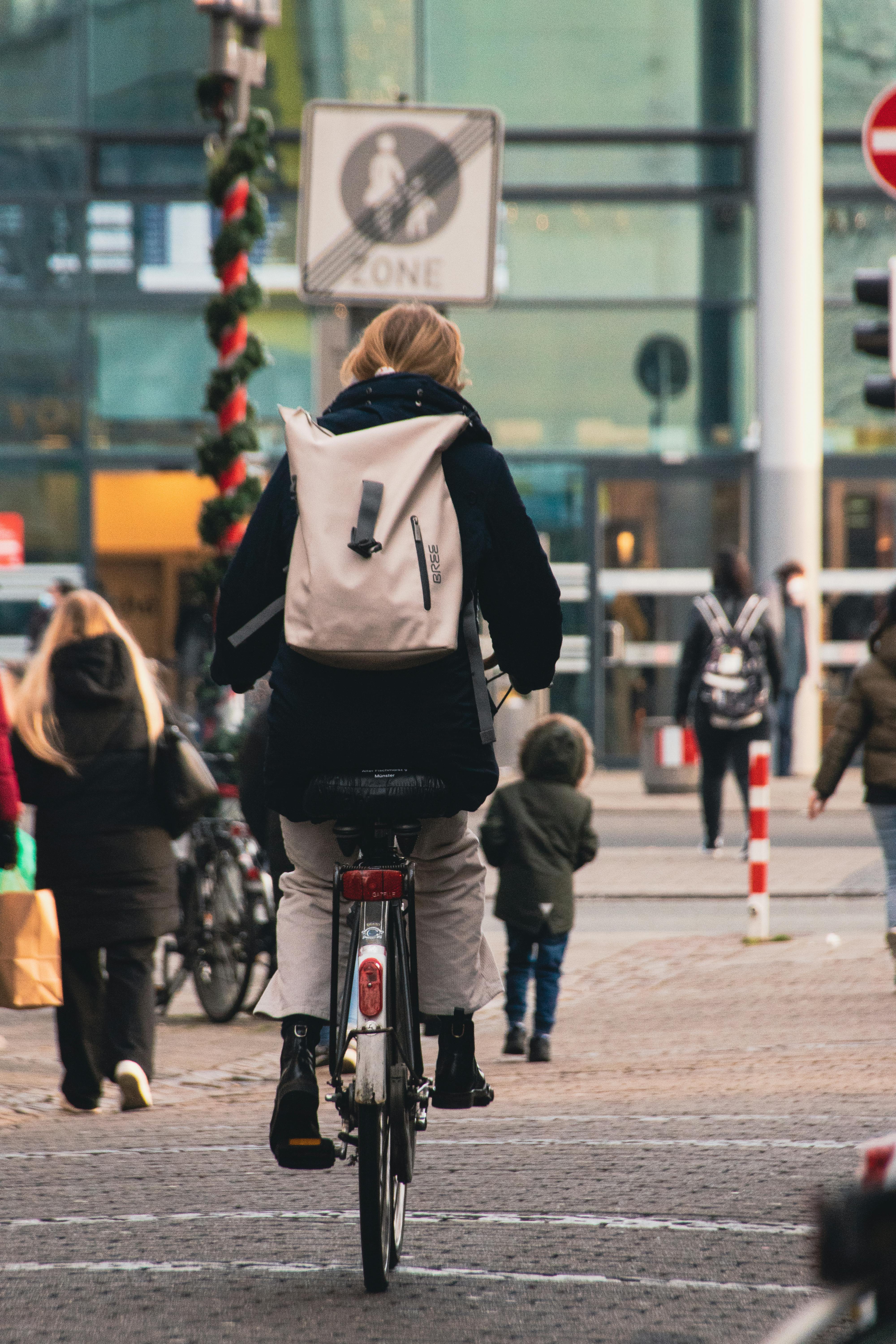 People Riding Bicycles on Road · Free Stock Photo